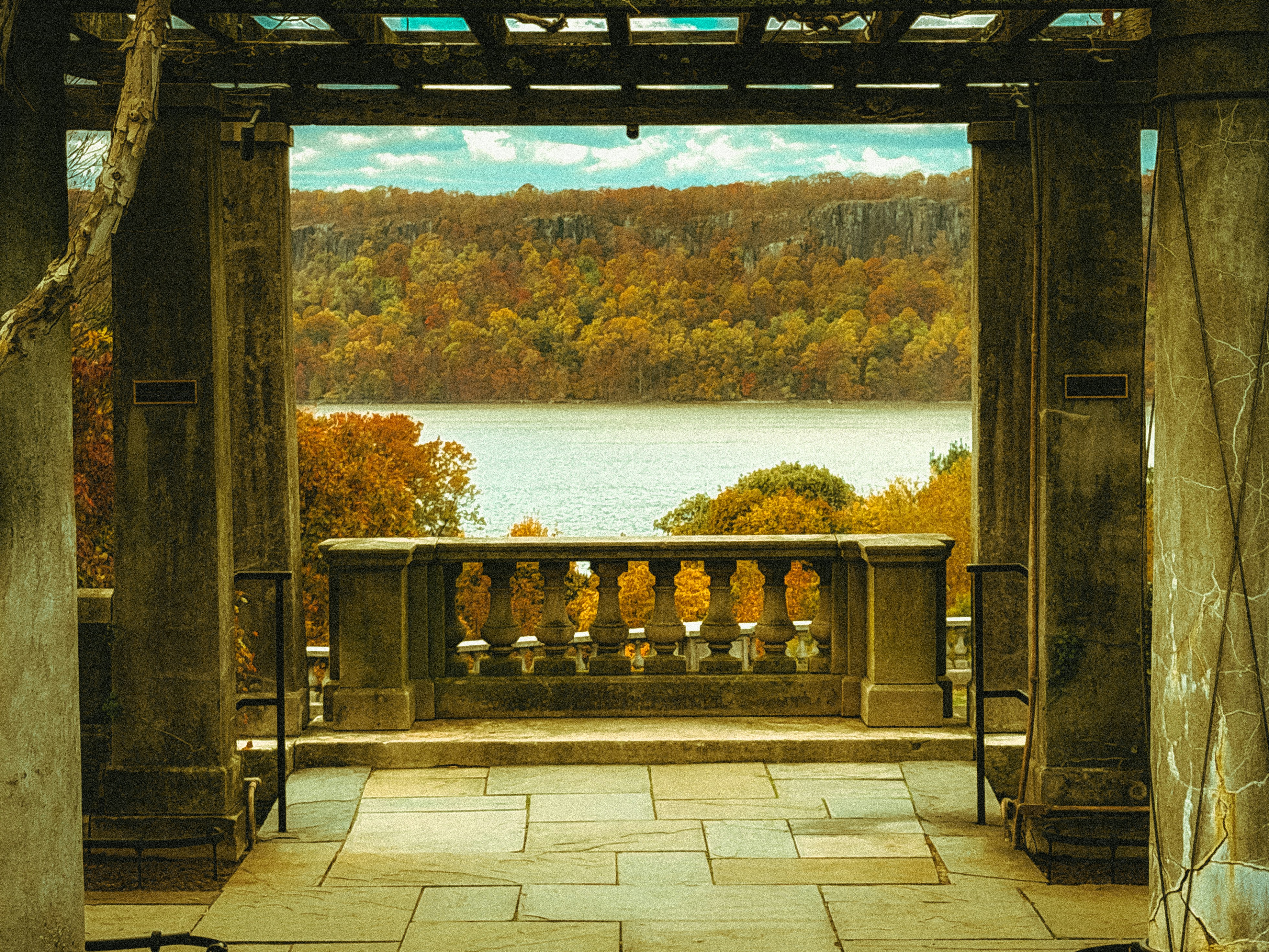 Through the Veranda's Frame: An Autumn River Vista