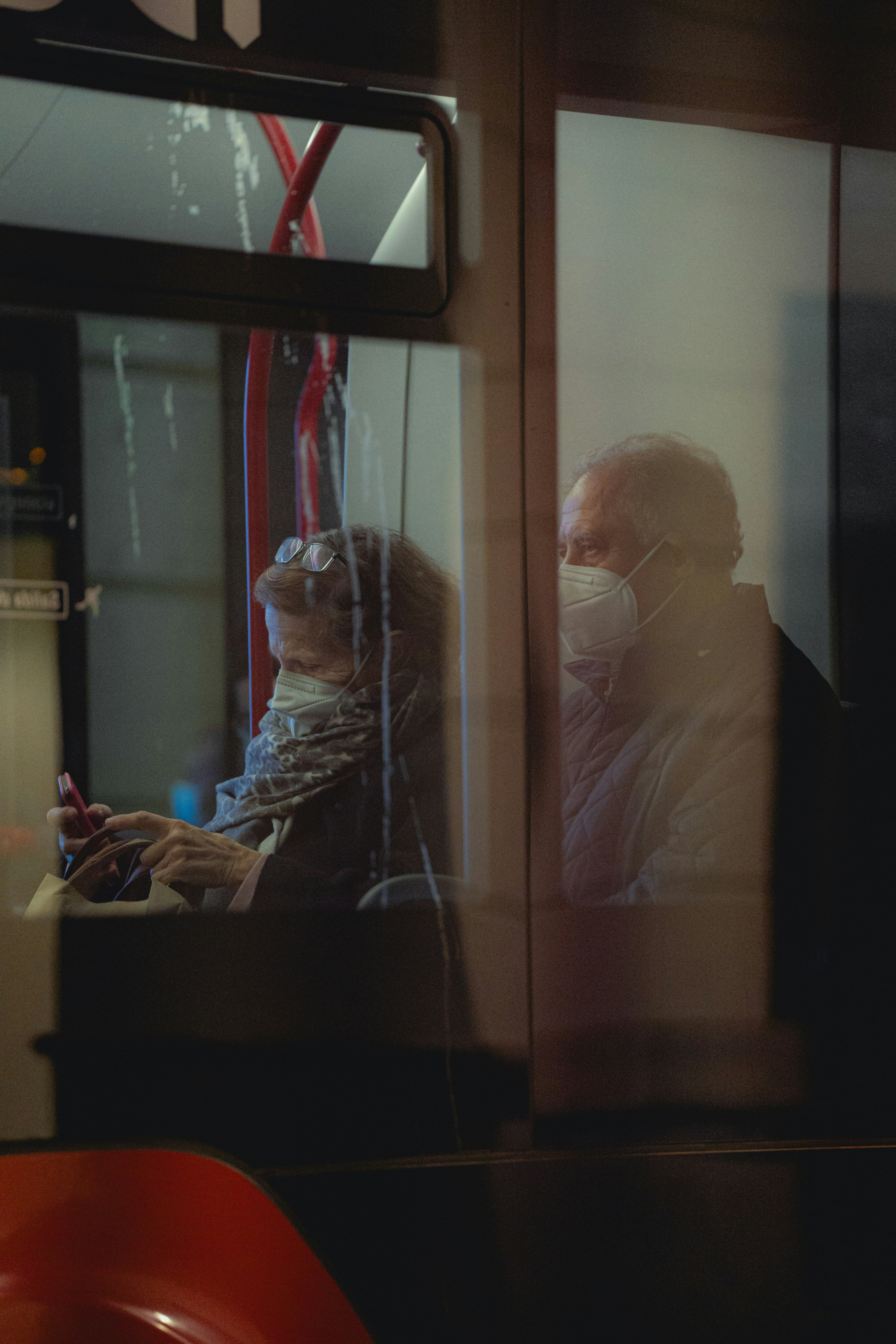 Reflections and Routine: A Glass-Frame Moment on the Commute