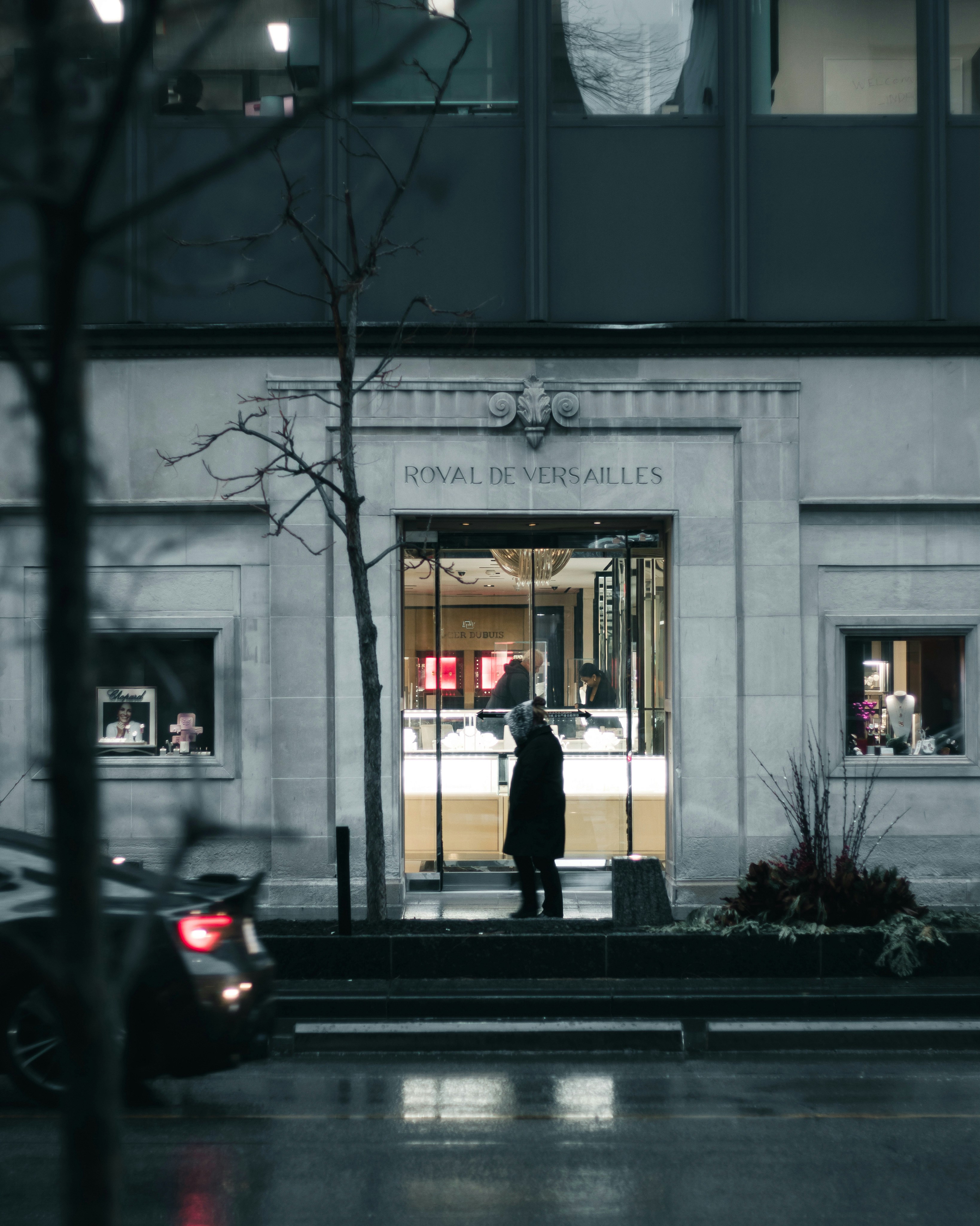 Midnight Threshold: A Solitary Figure in a Glowing Boutique Entrance
