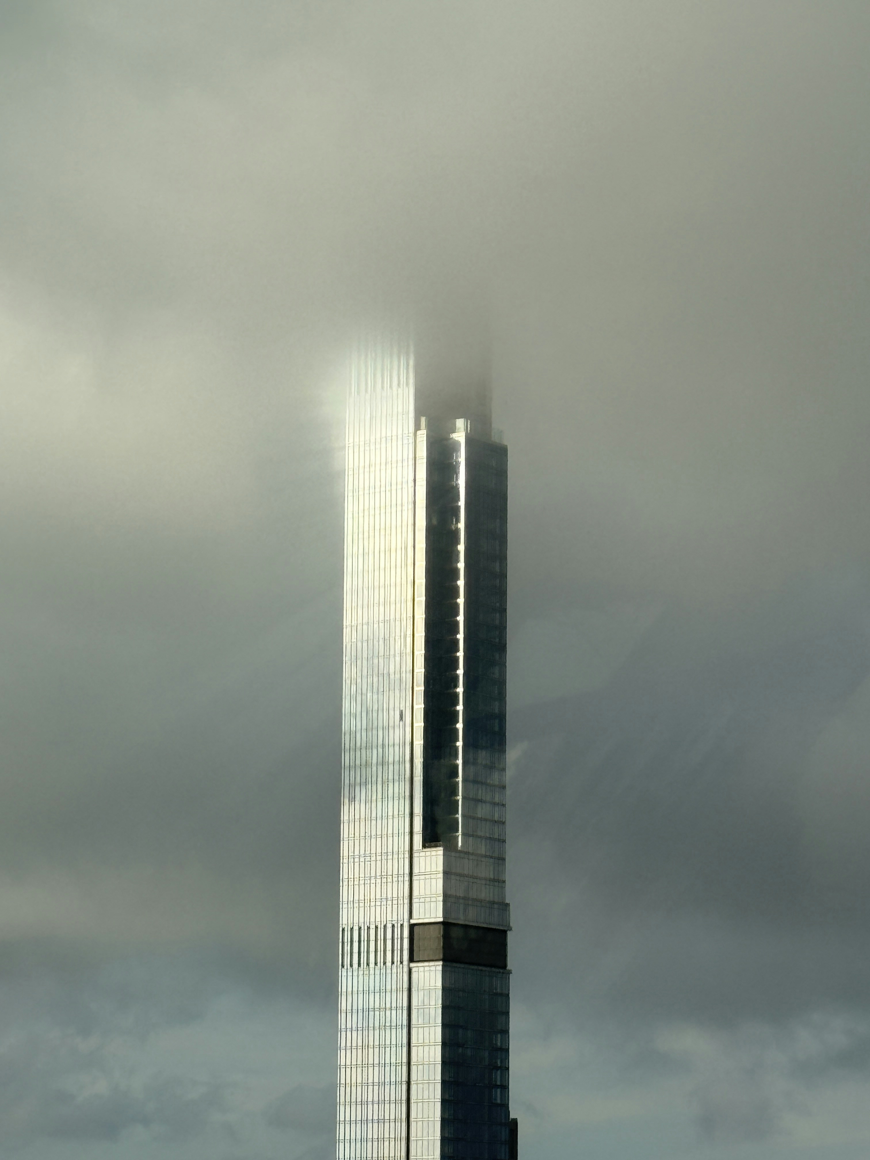 Magic looking tall skyscraper in the clouds.