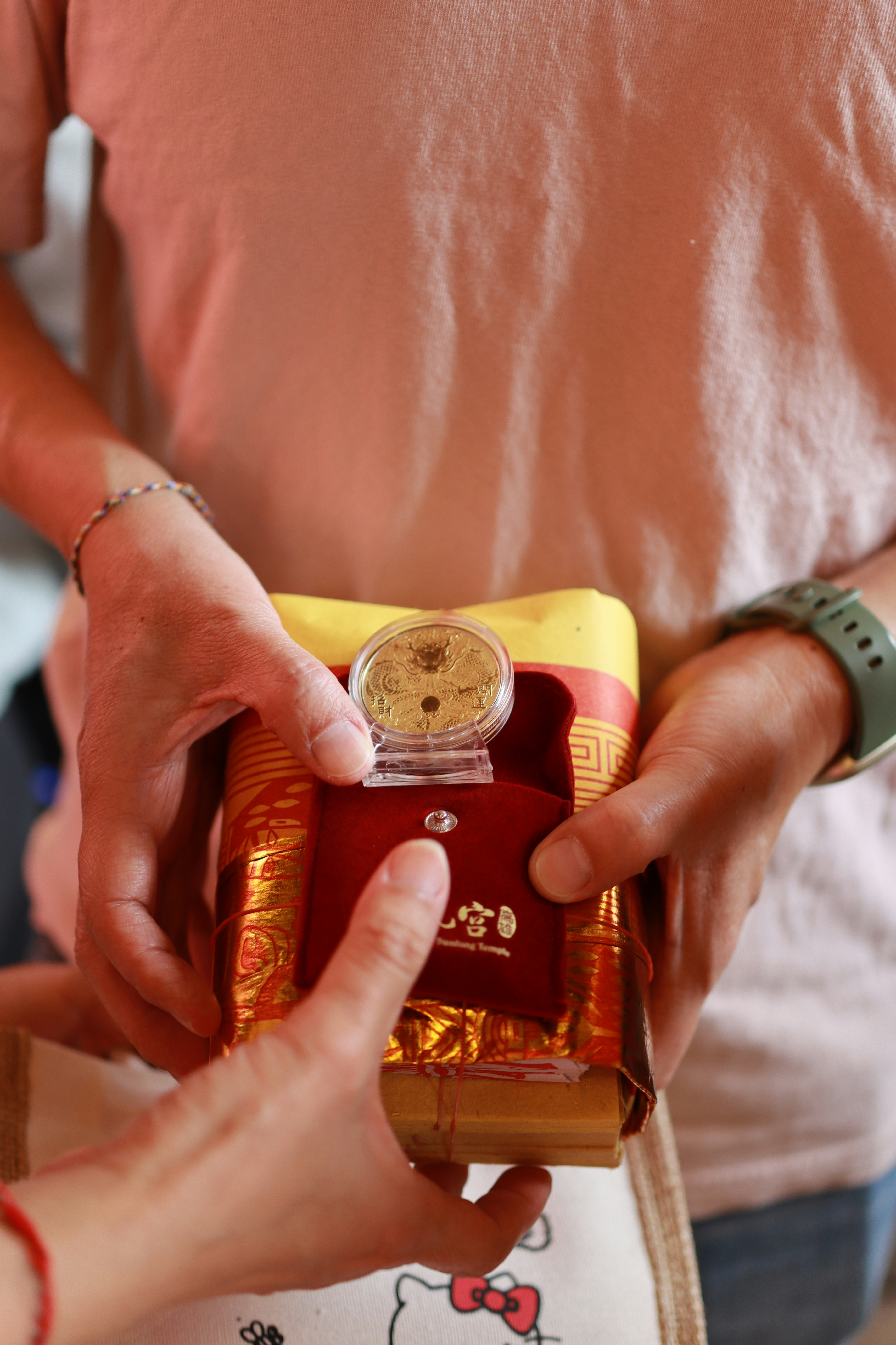 Hands Pass a Sacred Keepsake: A Wedding Gift Exchange