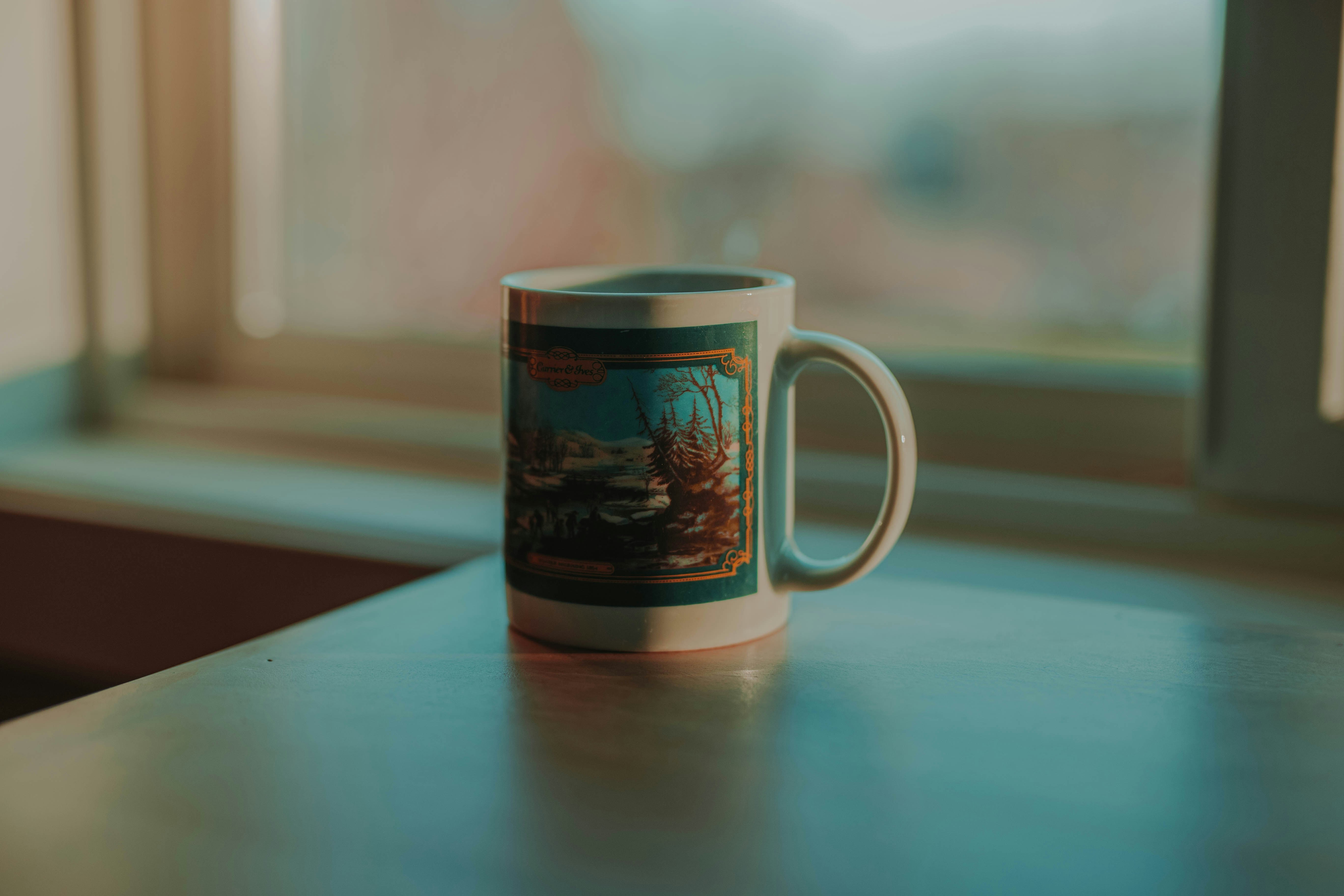 Warm Window Light Embraces a Ceramic Mug on Wood