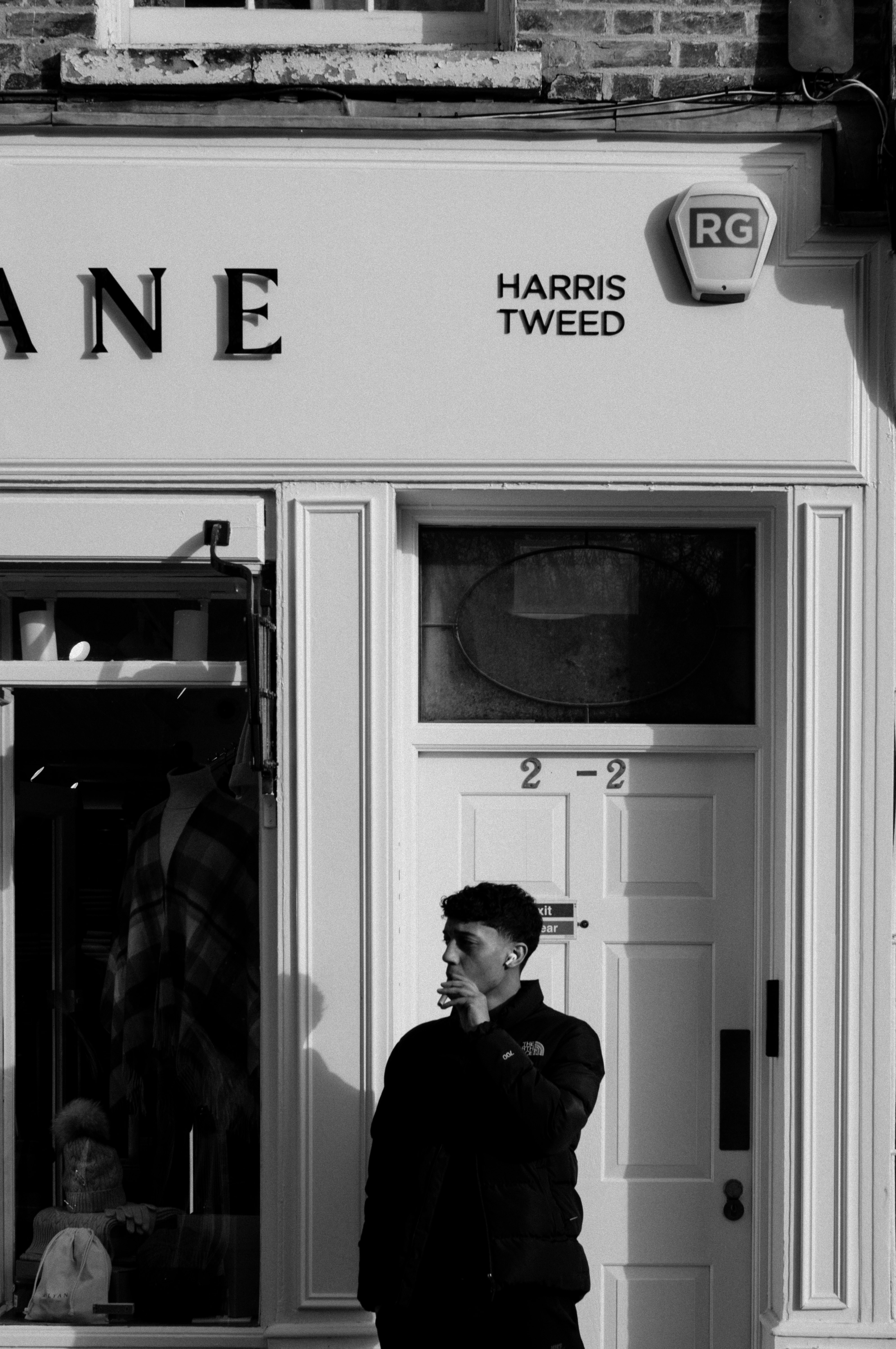 Shadows at the Doorstep: A Quiet Street Portrait by Harris Tweed