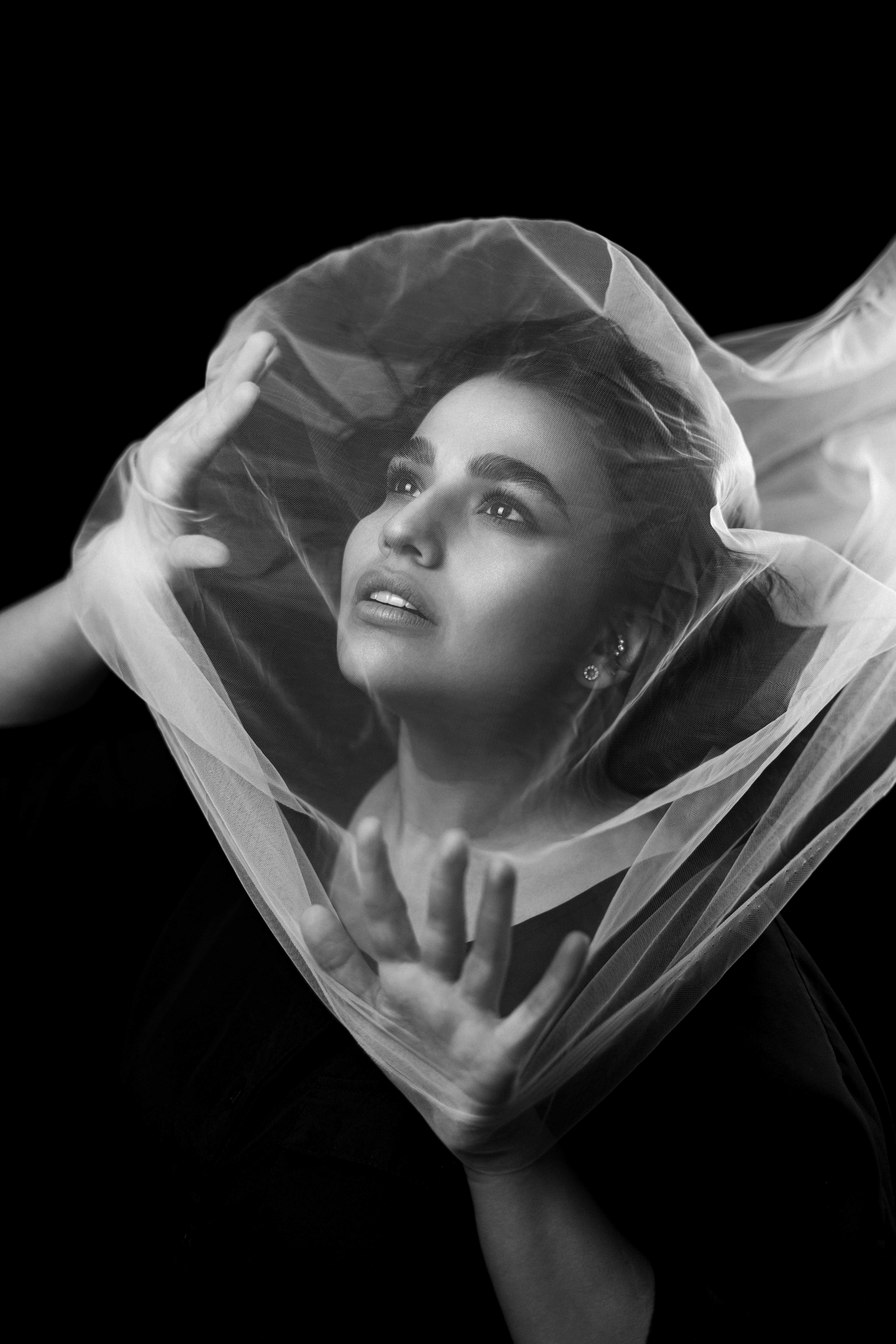 Veiled Gaze: Portrait in Silk and Shadow