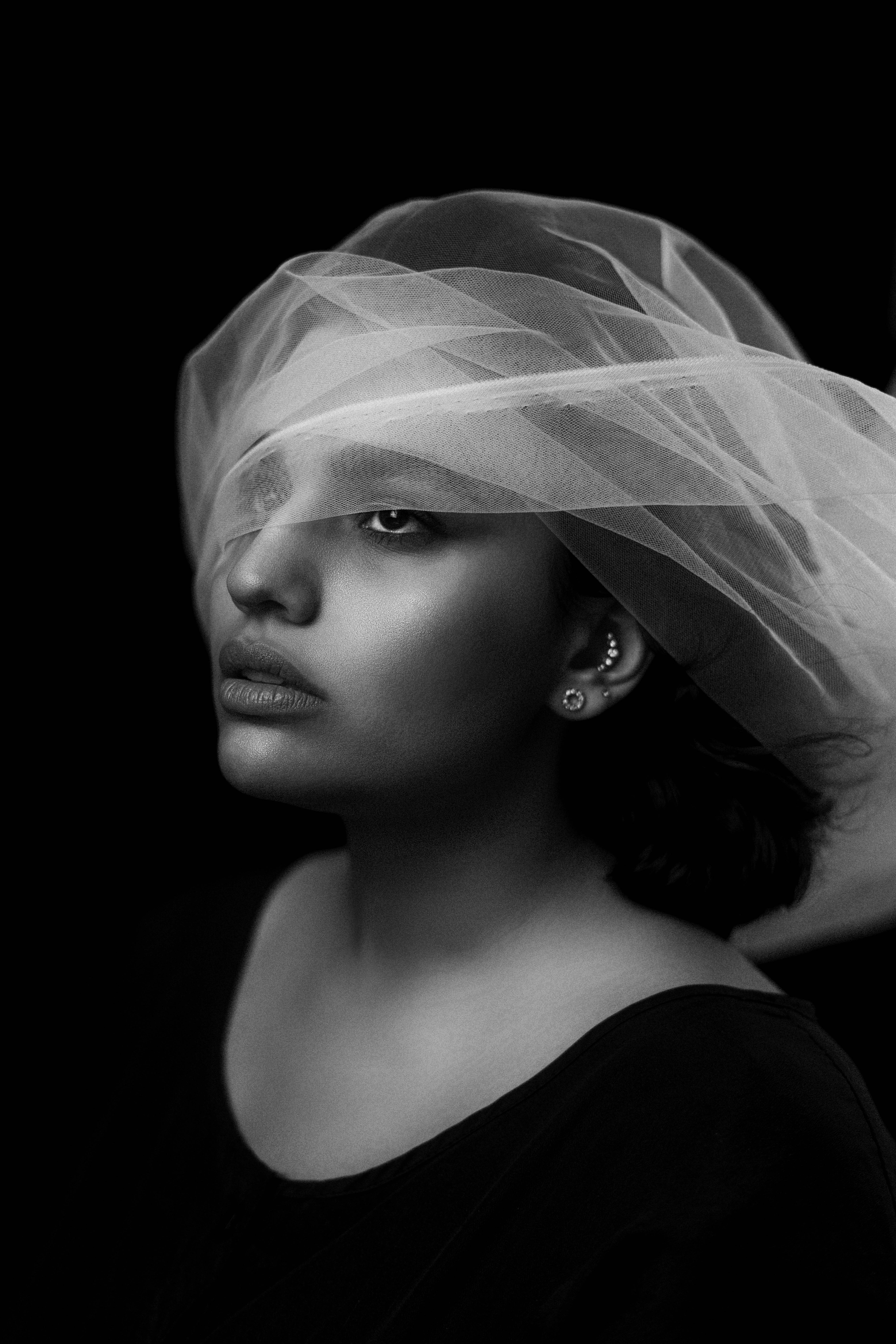 Veiled Gaze: A Portrait Carved by Light and Shadow