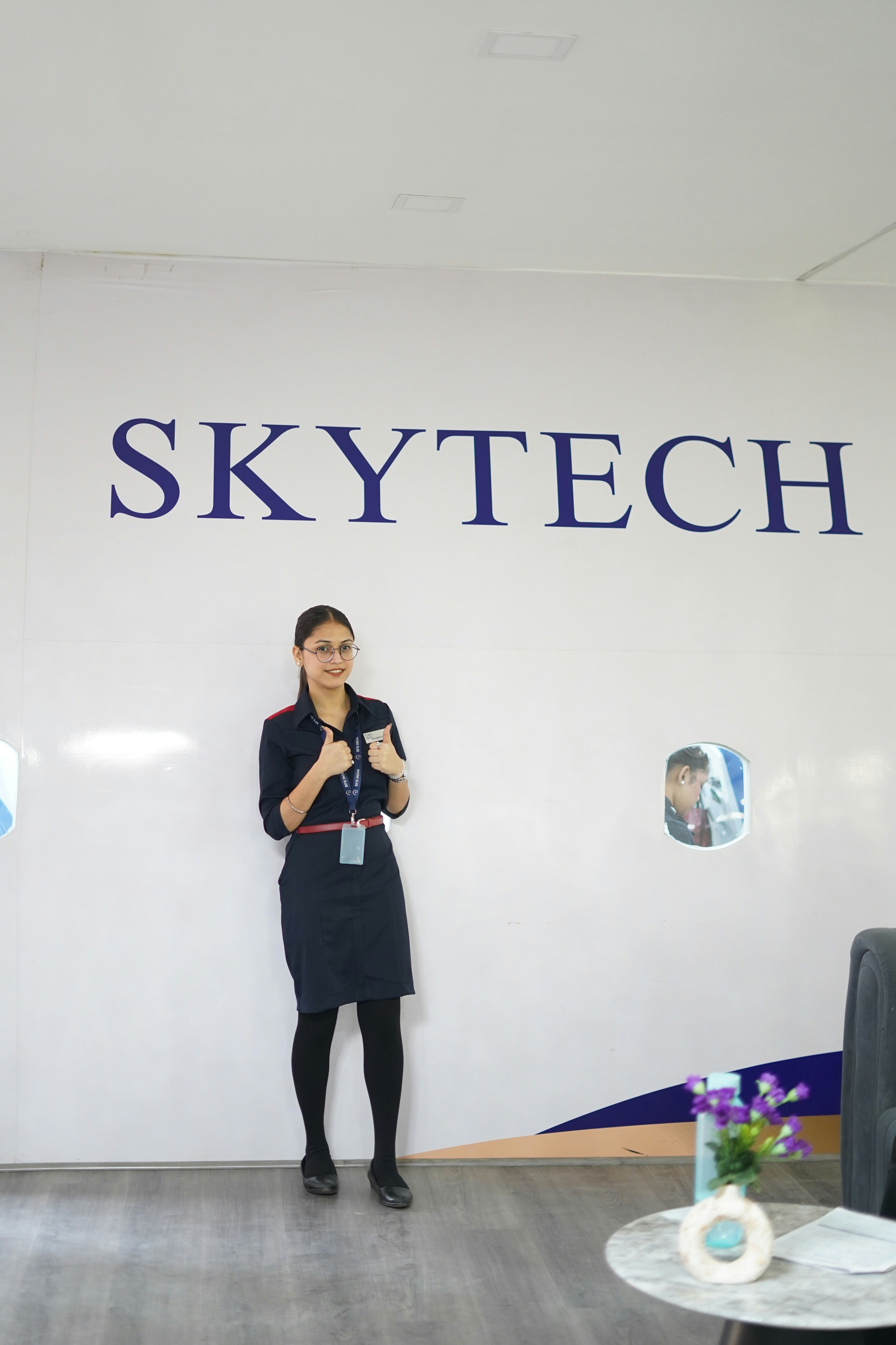 Thumbs Up at SKYTECH: Quiet Confidence by the Showroom Wall