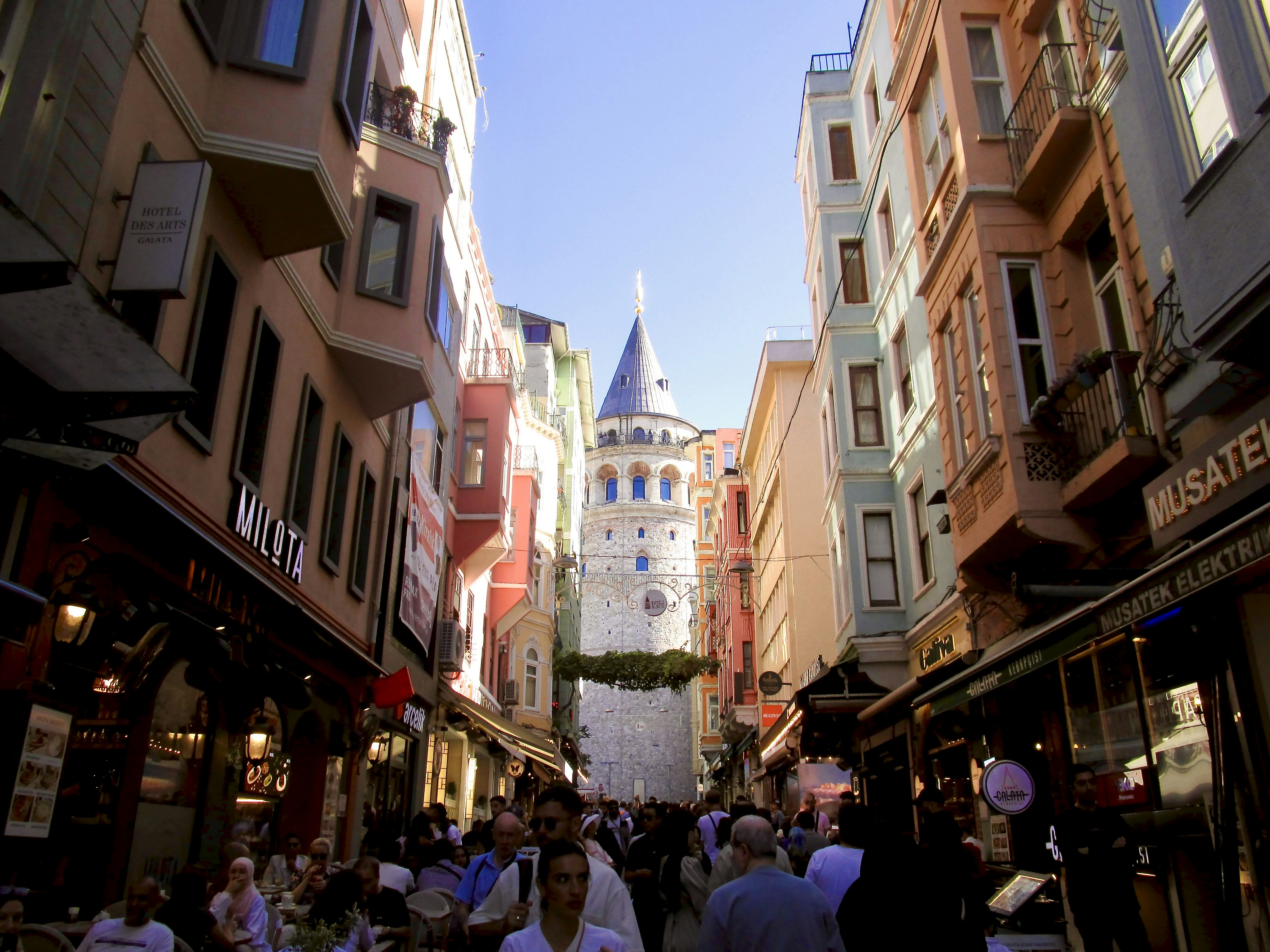 Galata tower viewed from a bustling street