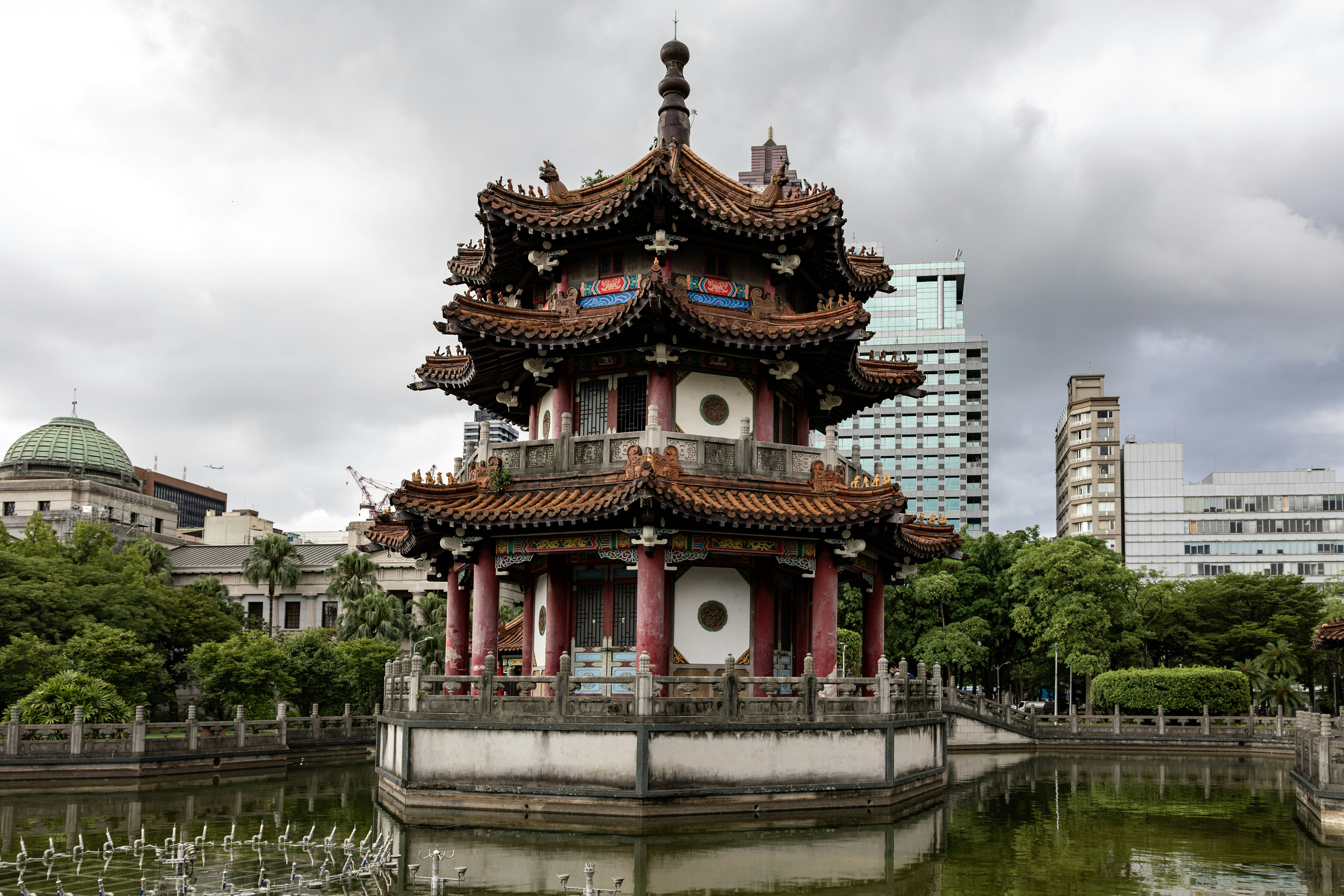 Waterbound Pagoda: Heritage Rising Between Reflections and Skyline