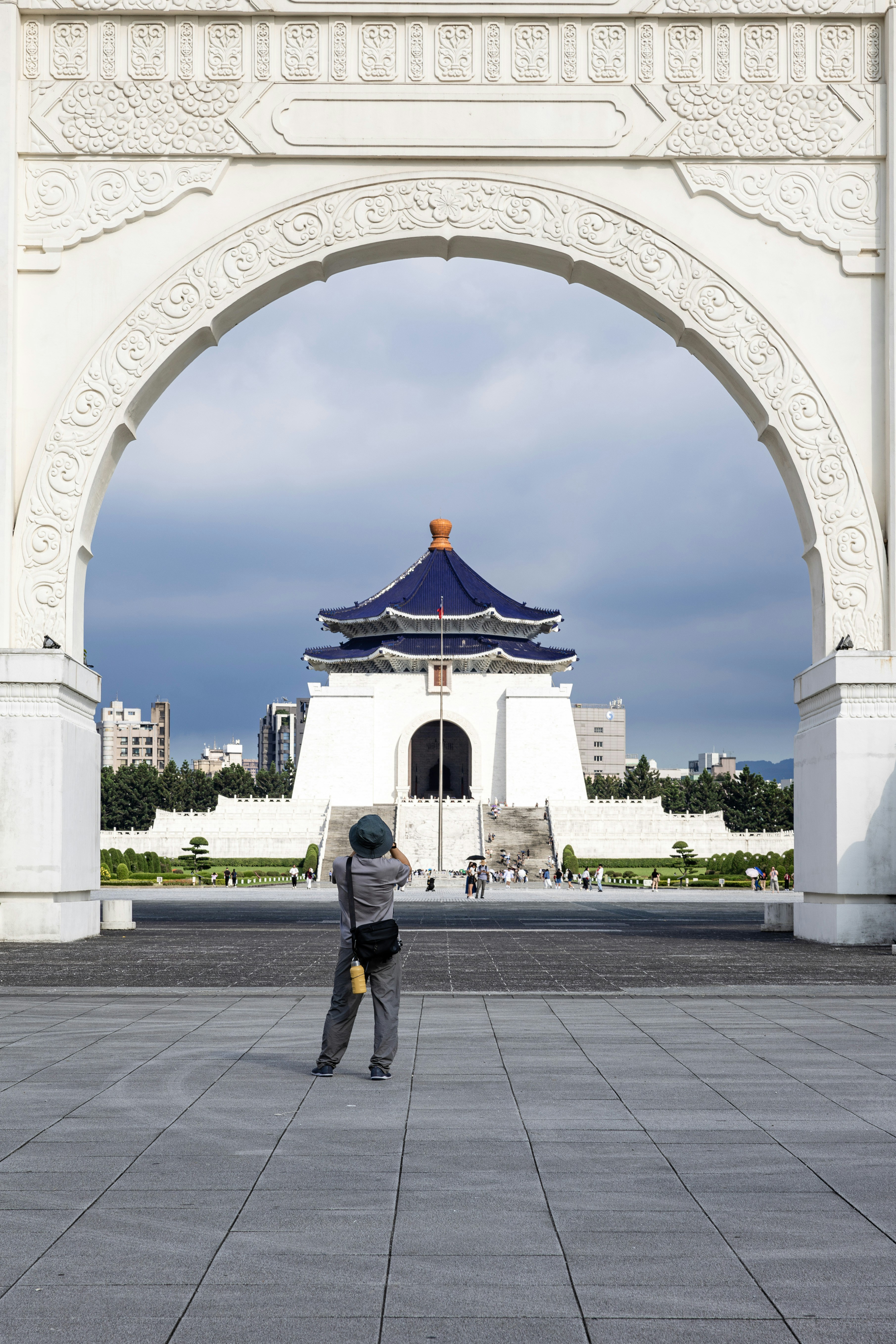 Gateway of White Marble: A Blue-Tiled Temple Framed by an Ornate Arch