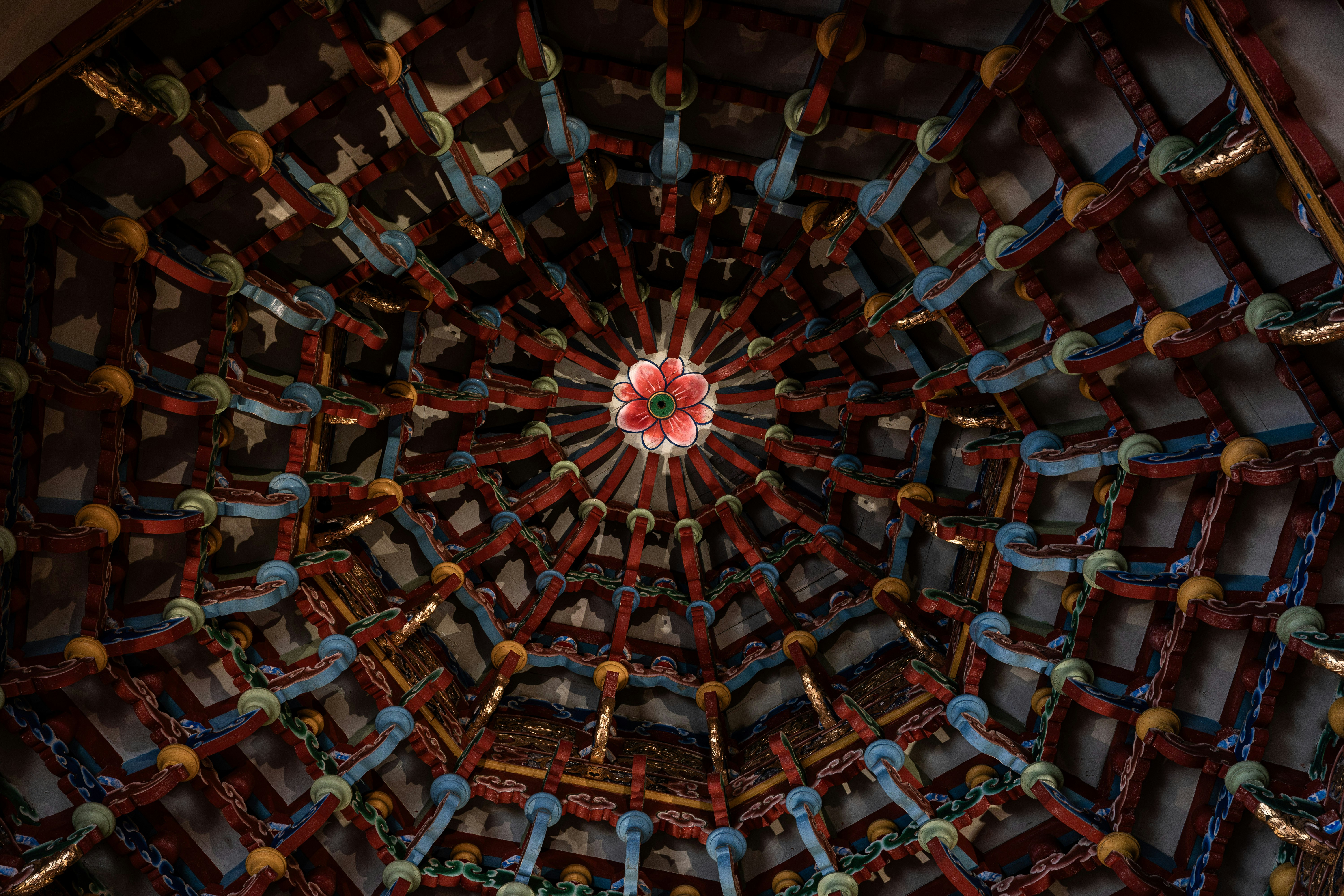 Radial Bloom: A Pink Core Among Radiating Colored Spokes