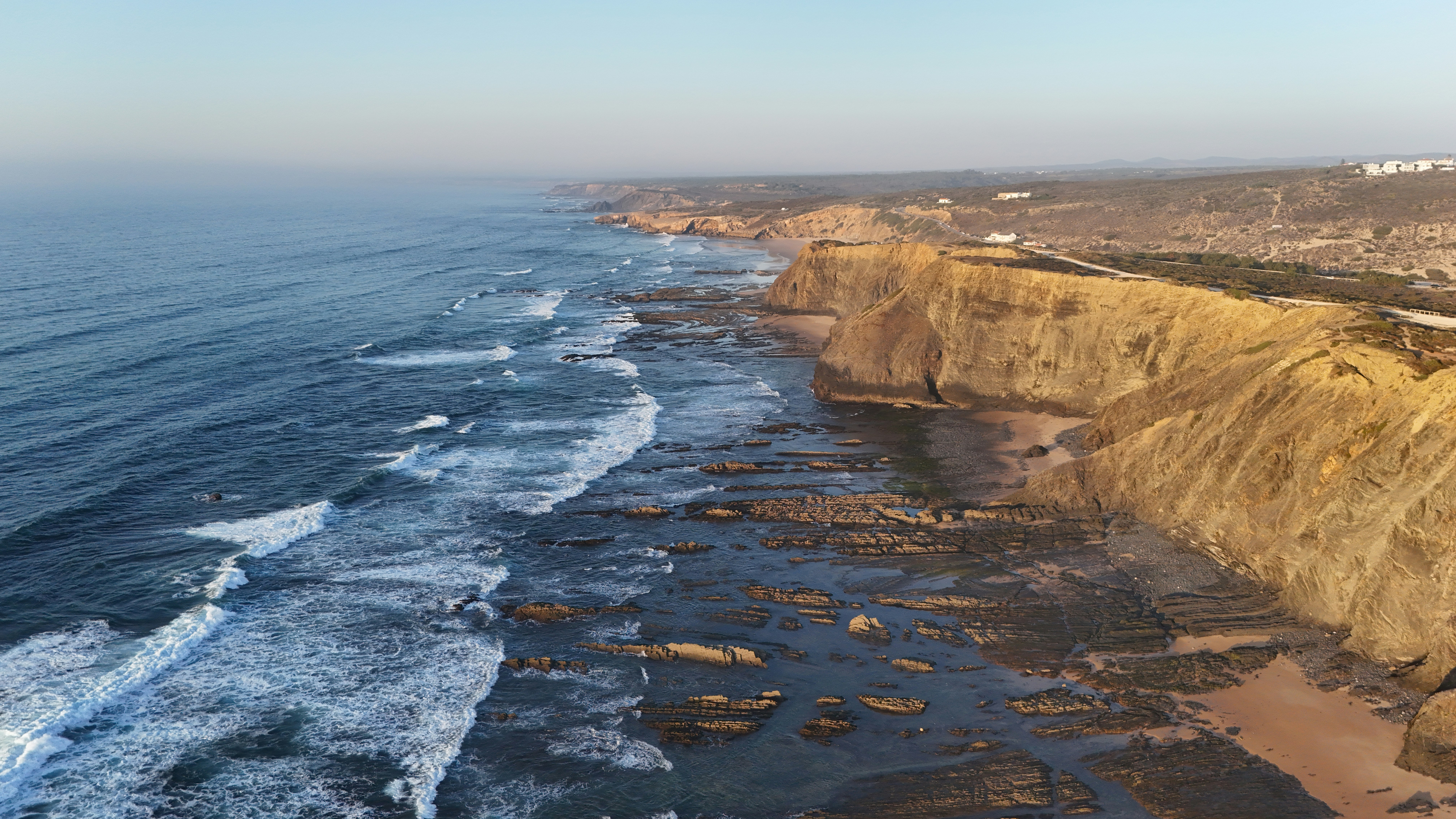 Edge of the Coast: Golden Light on Cliffs and Sea