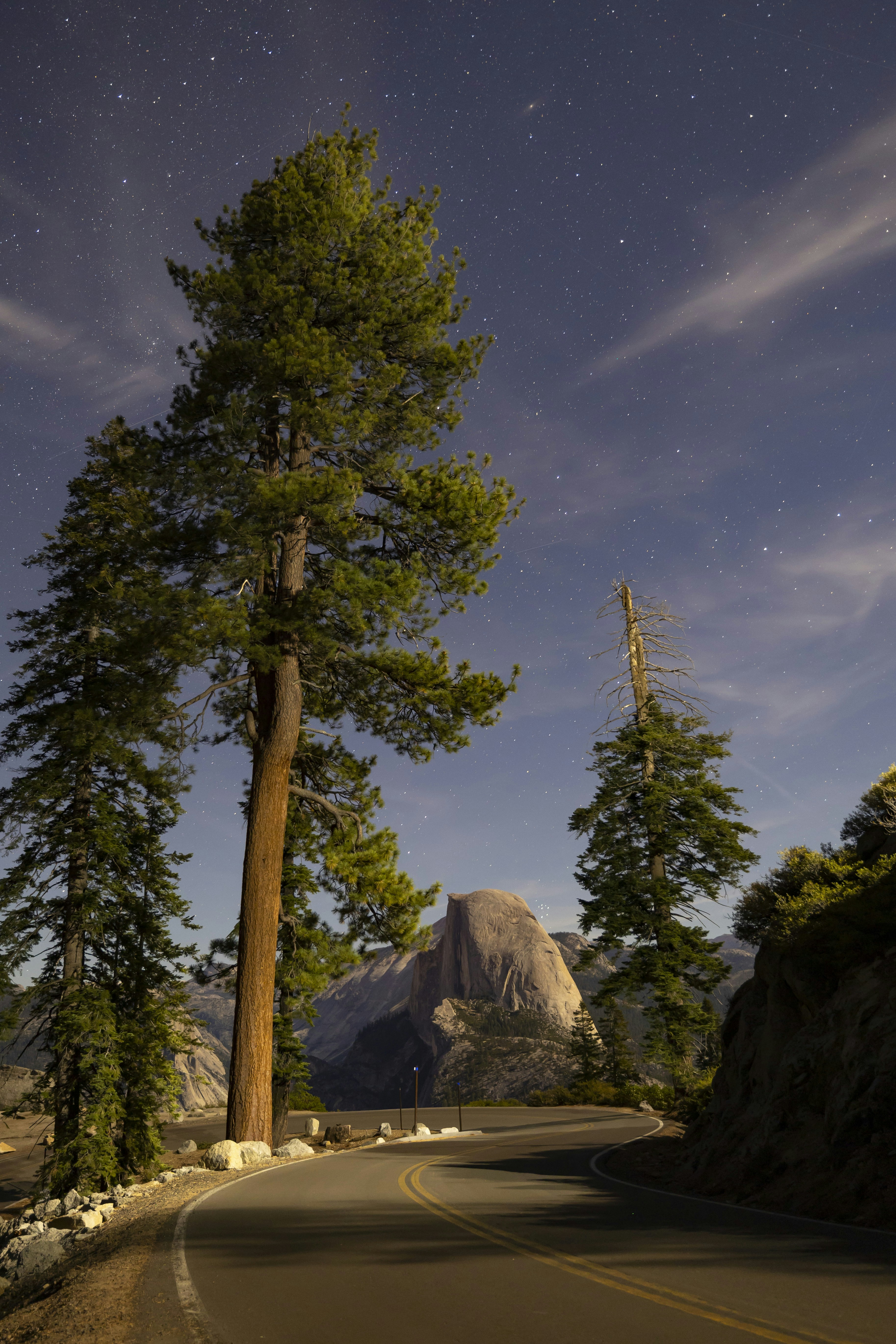Starry Route: Night Drive Toward a Sierra Granite Monolith