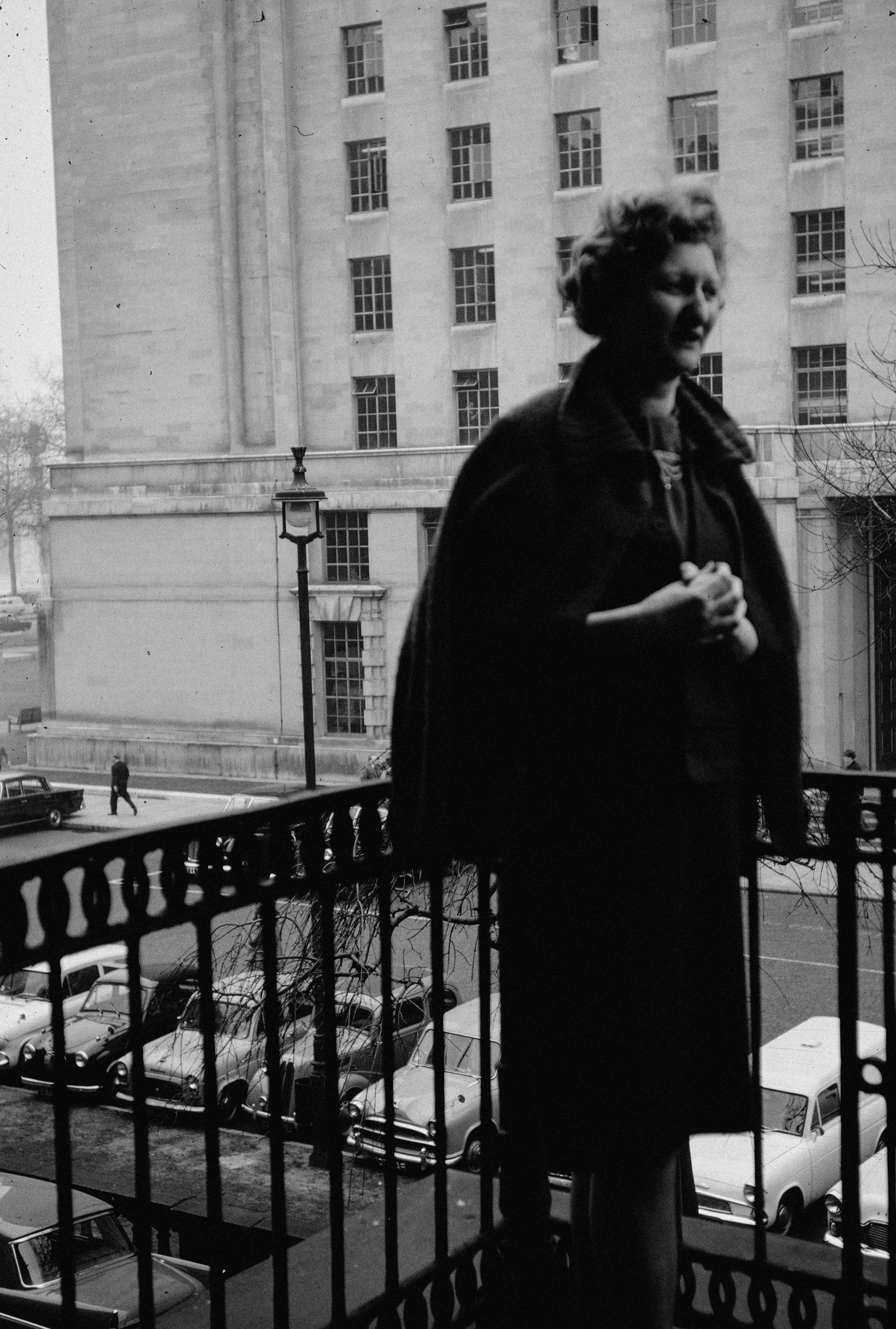 Balcony Portrait in Monochrome: A Quiet City Moment