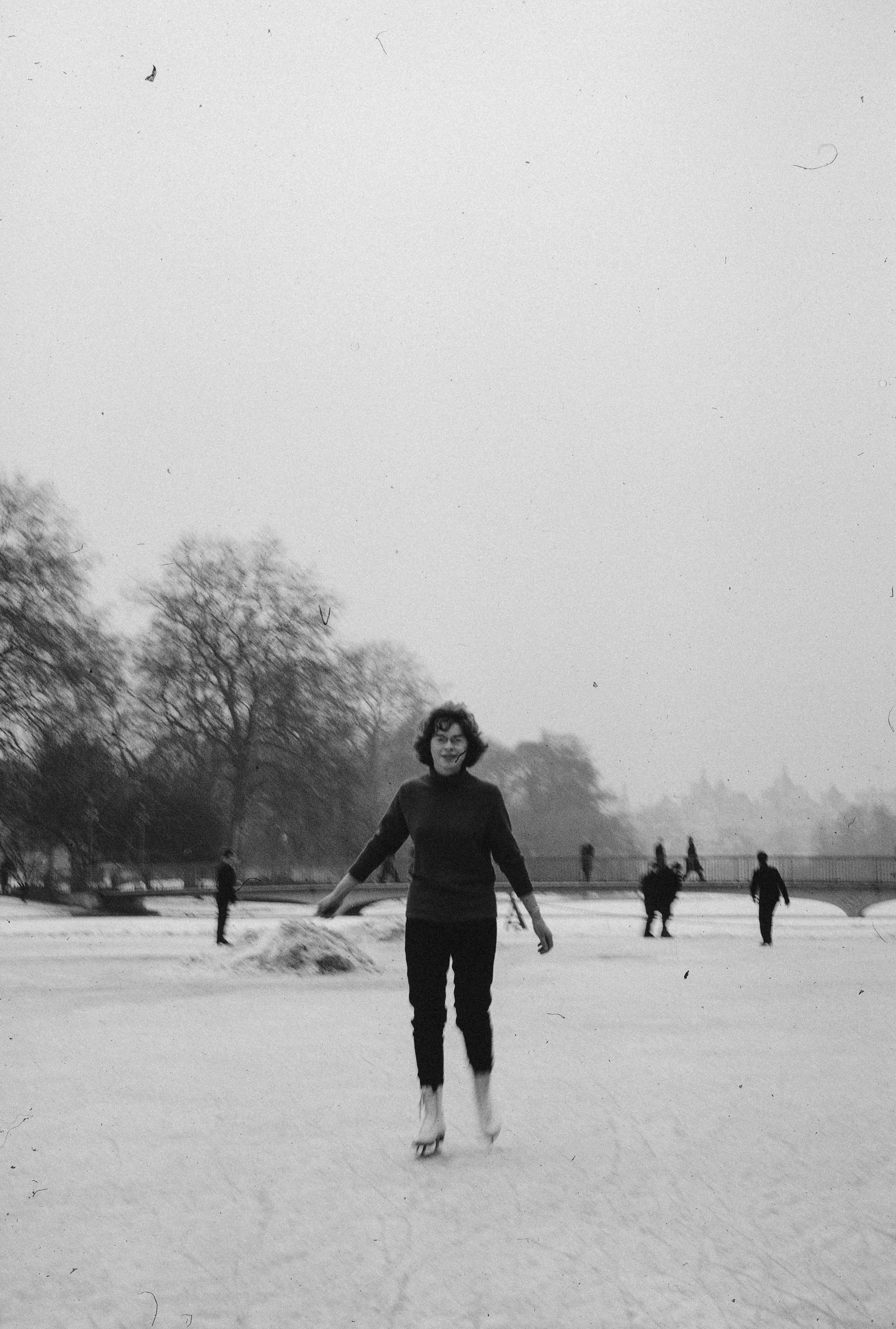 Midwinter Glide: A solitary skater on a quiet frozen river