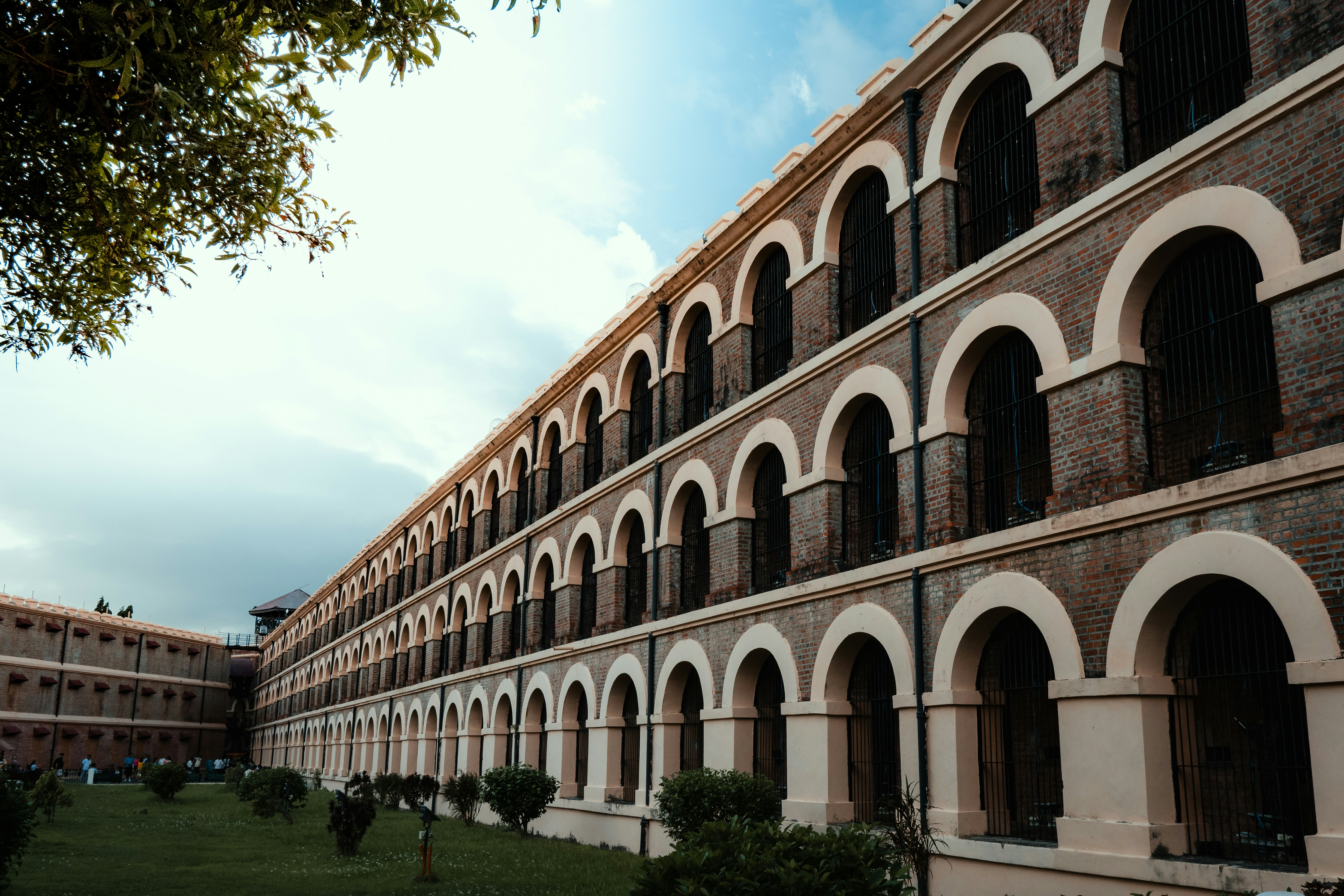 Brick Arcades Receding into a Sunlit Horizon