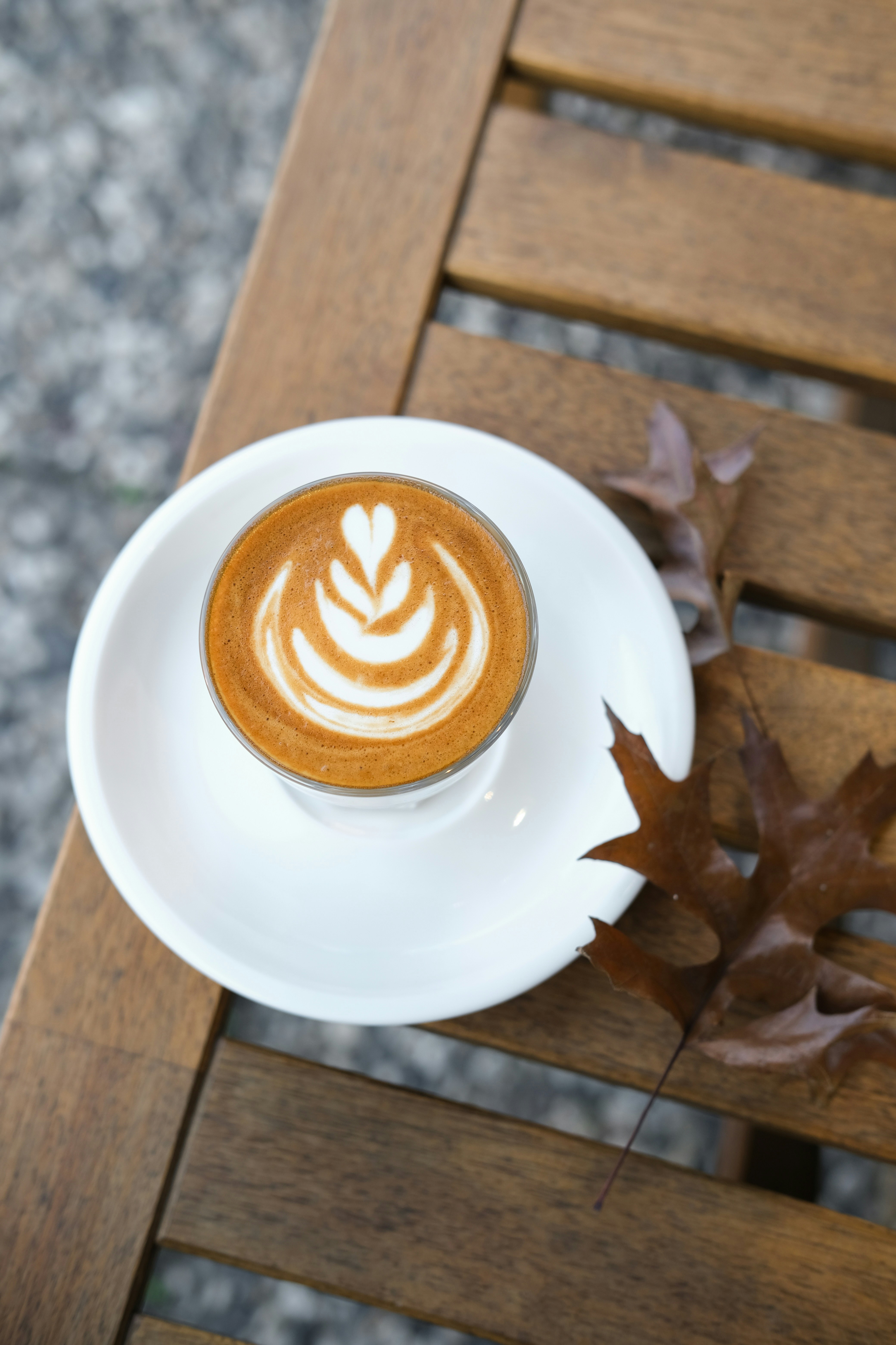 Rosette Latte on Weathered Wood: An Autumn Coffee Moment