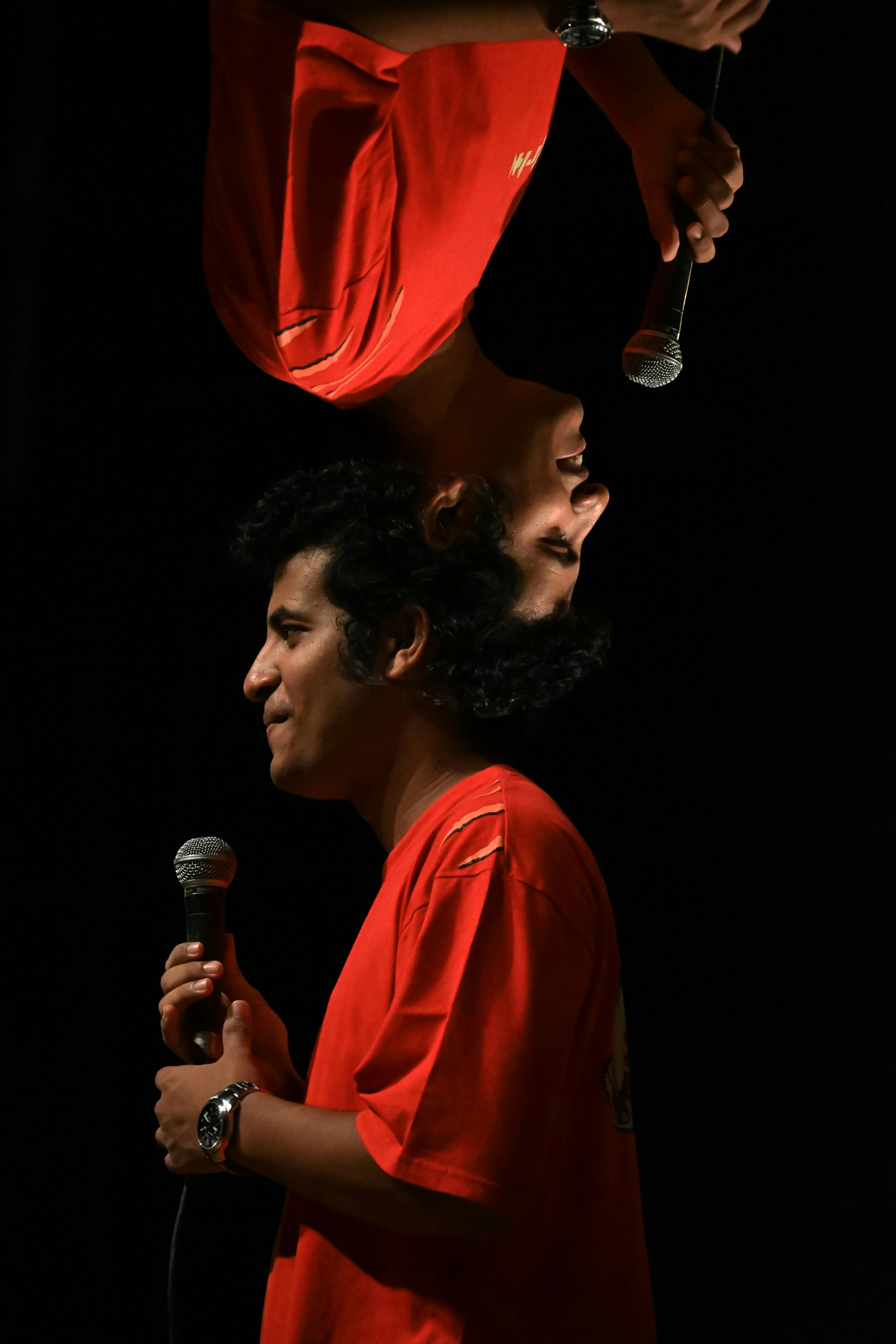 The still frame of a stage moment, where confidence meets quiet thought.