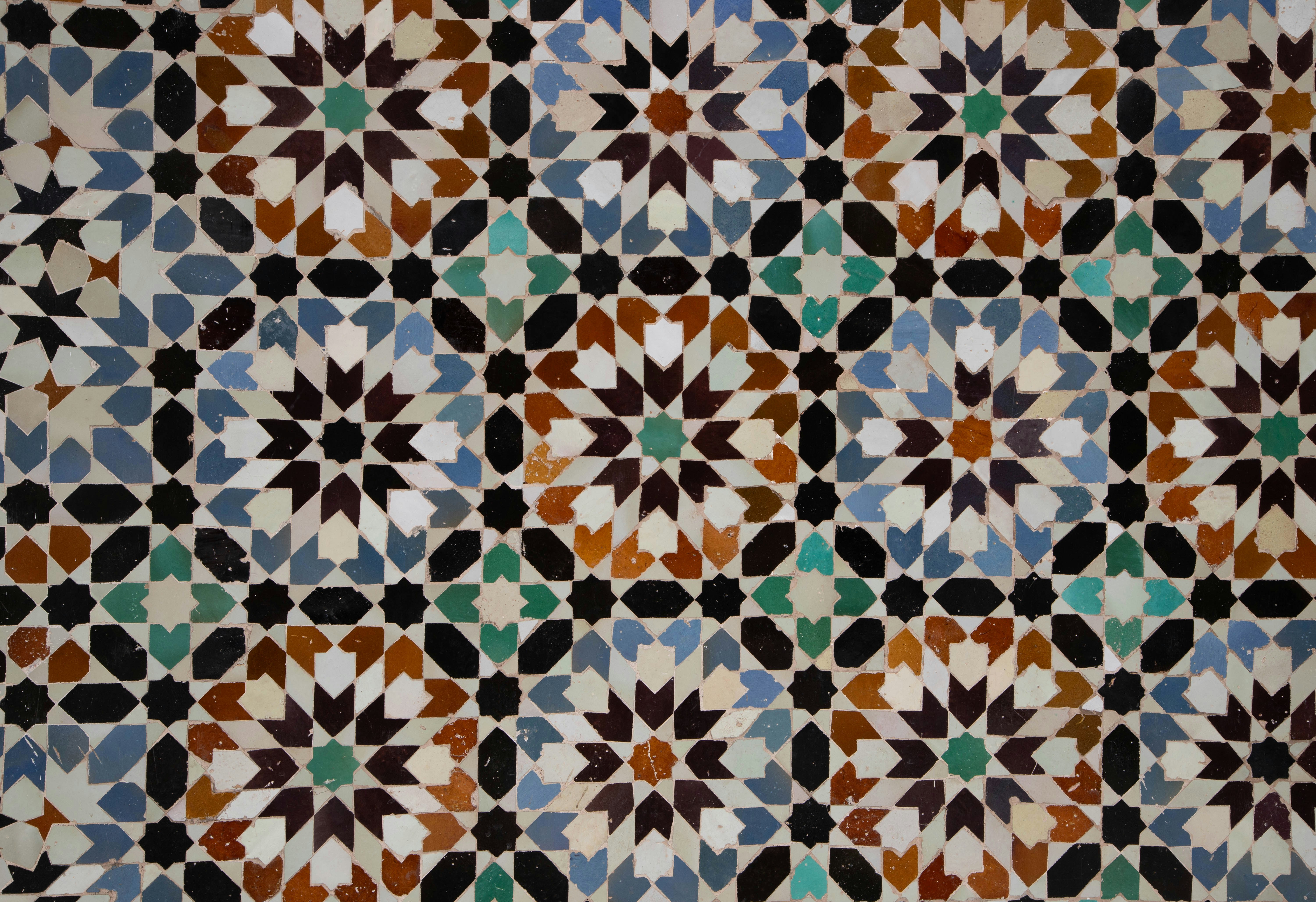 Intricate geometric mosaic tile pattern in earthy tones. photo – Free ...