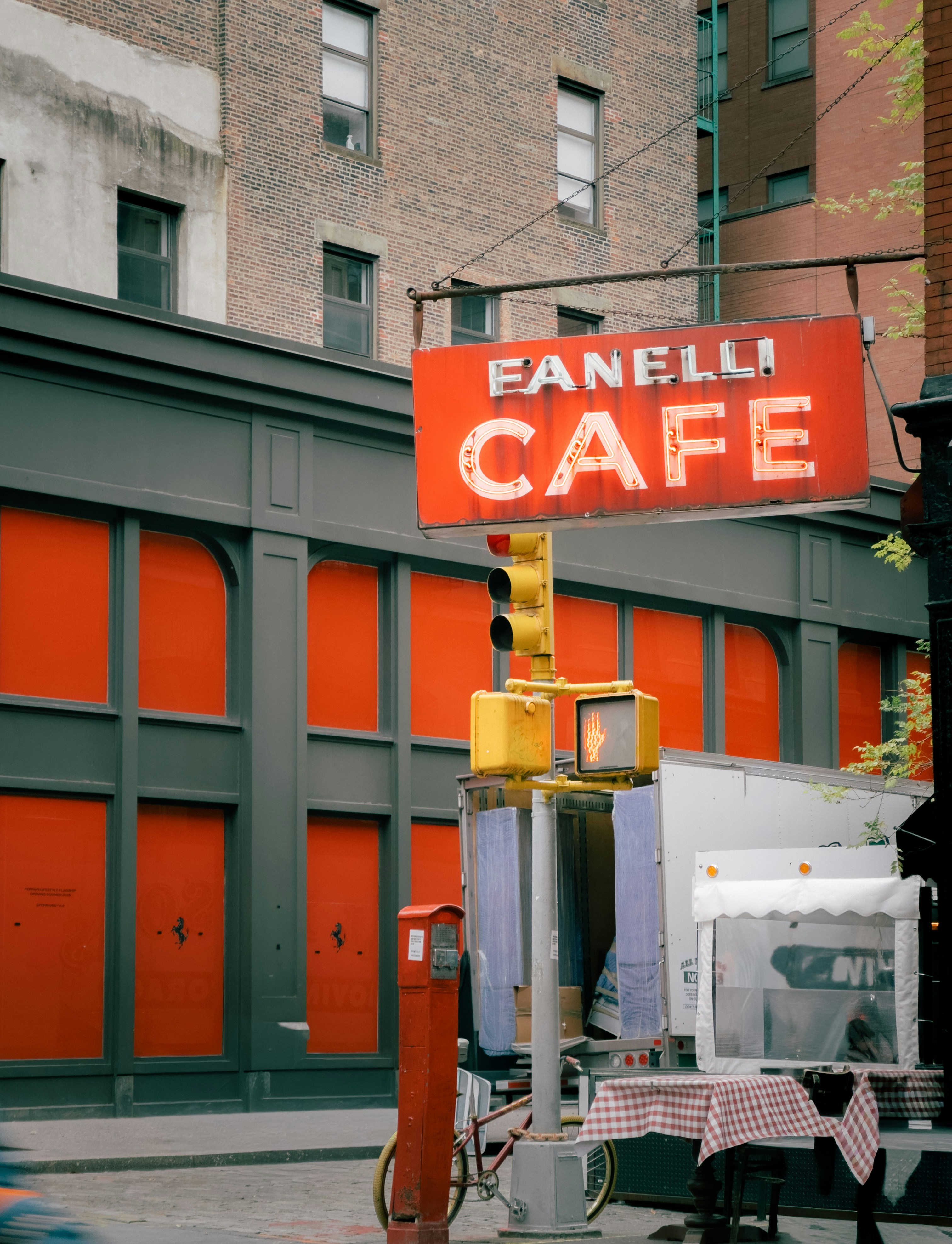 FANELLI CAFE Neon Sign Anchors a Quiet City Block