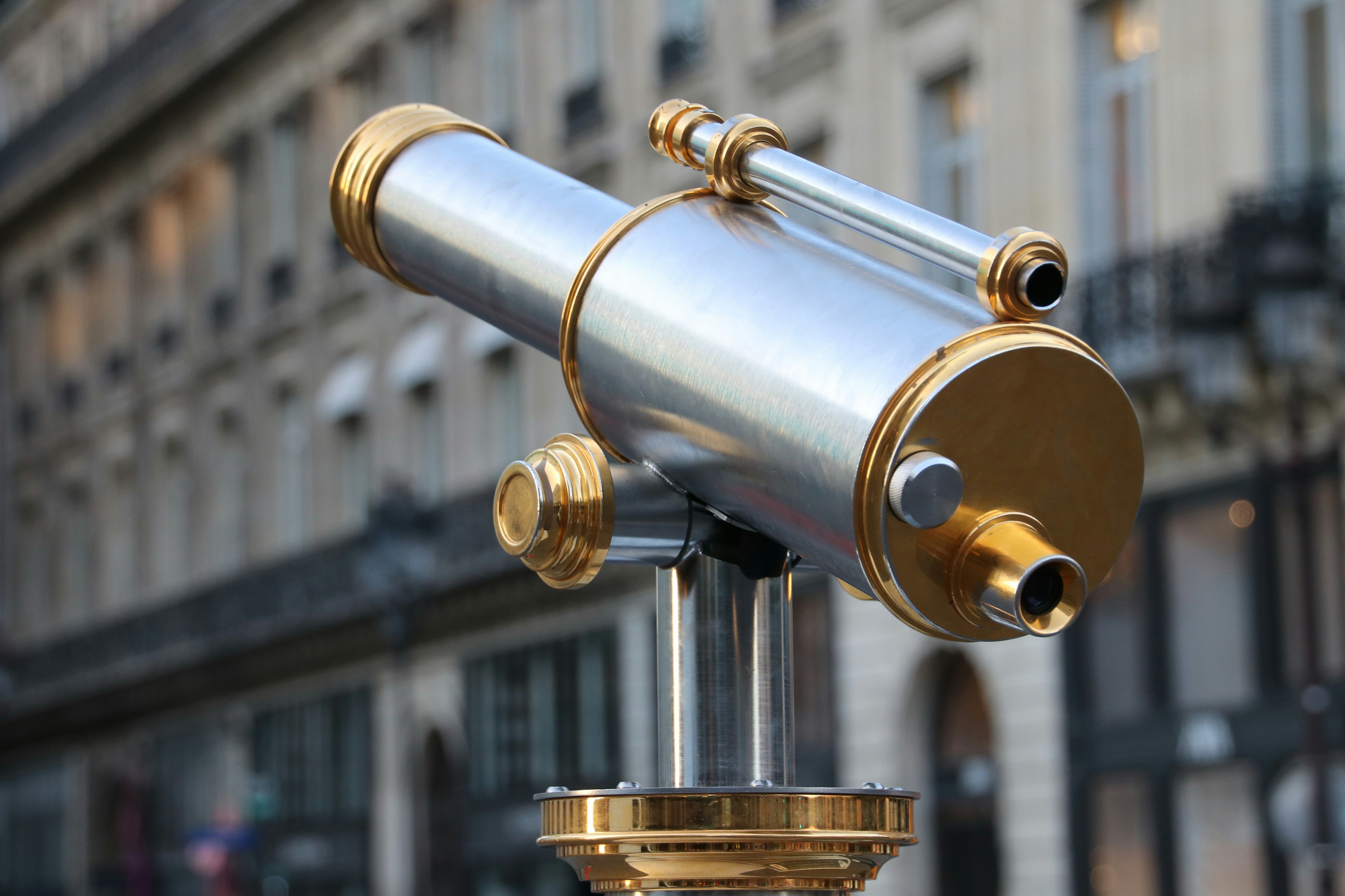 Brass Gazer on a City Street: A Close-Up of a Street Telescope