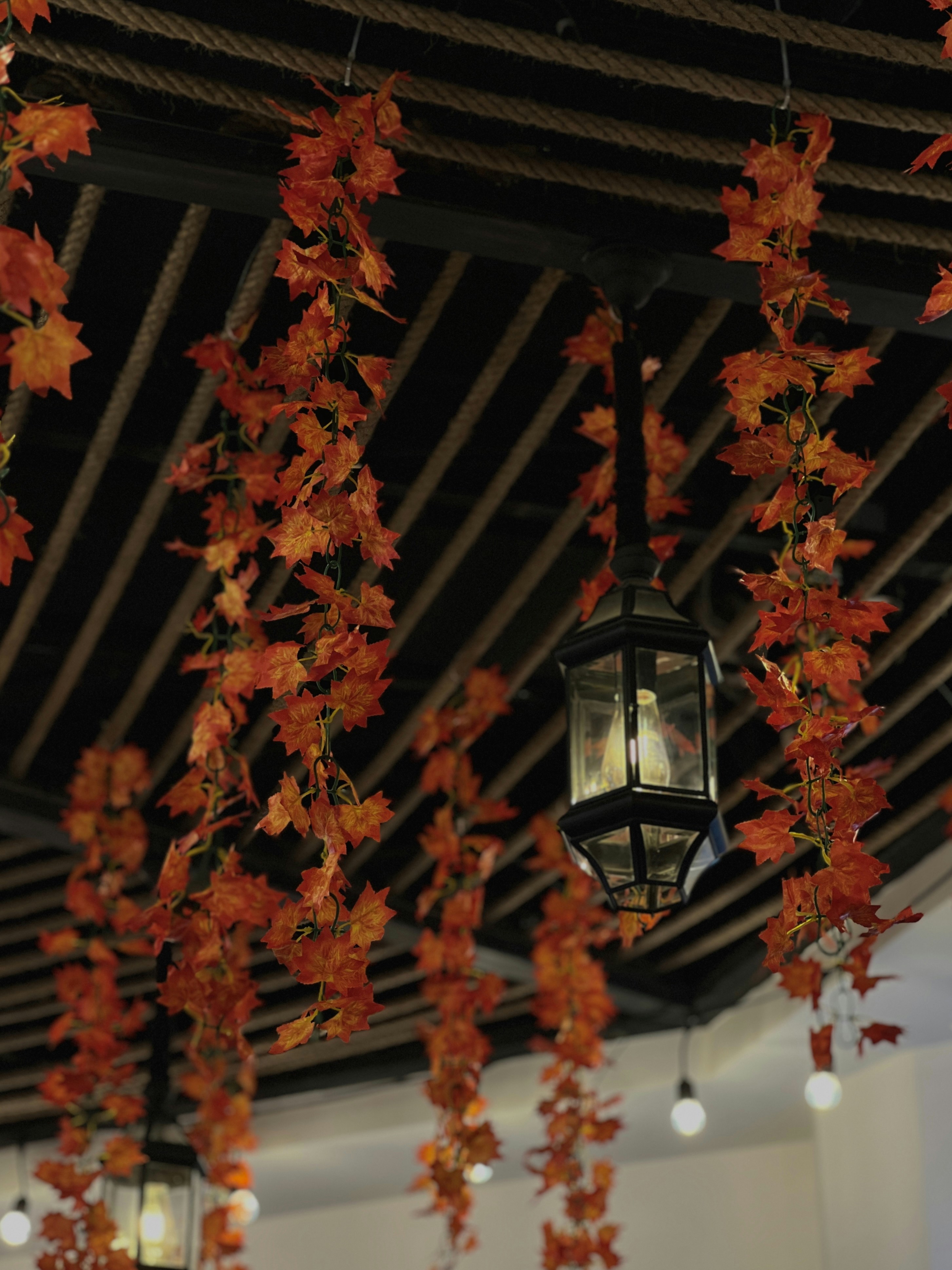 Lantern Framed by Autumn Garlands