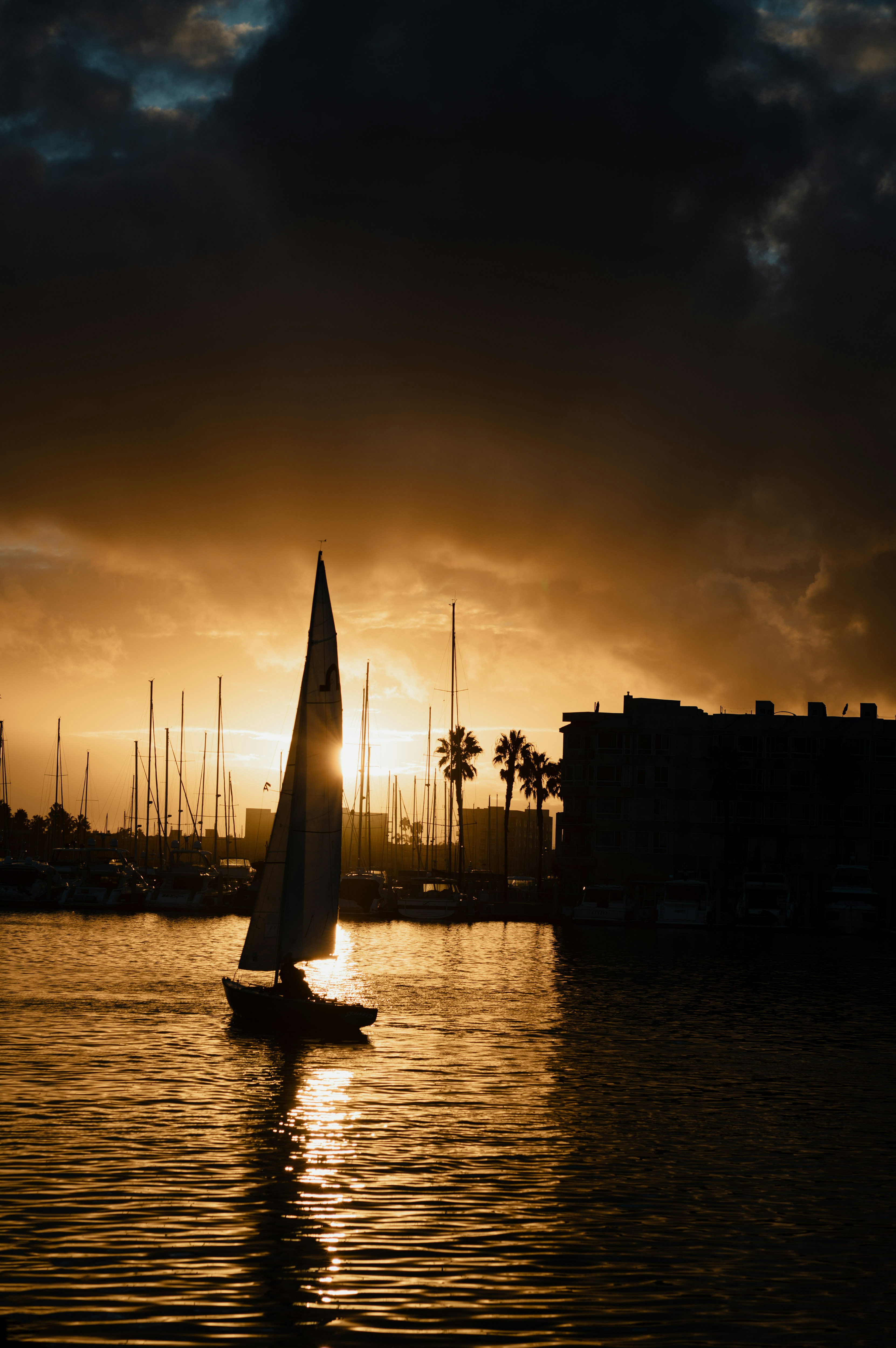 Sailboat Against a Molten Horizon at Sunset