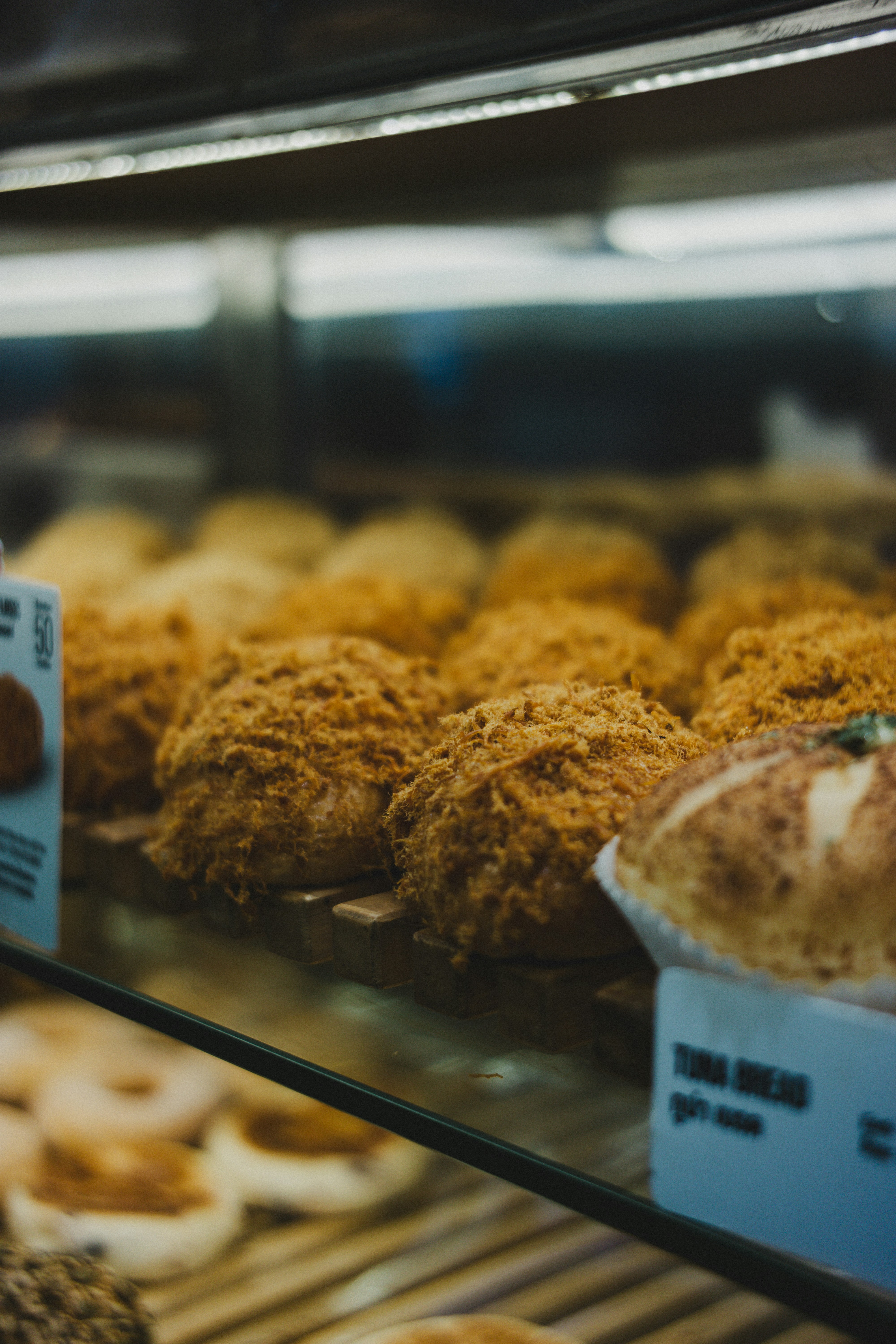 Crumbed Delights in a Glass Bakery Display