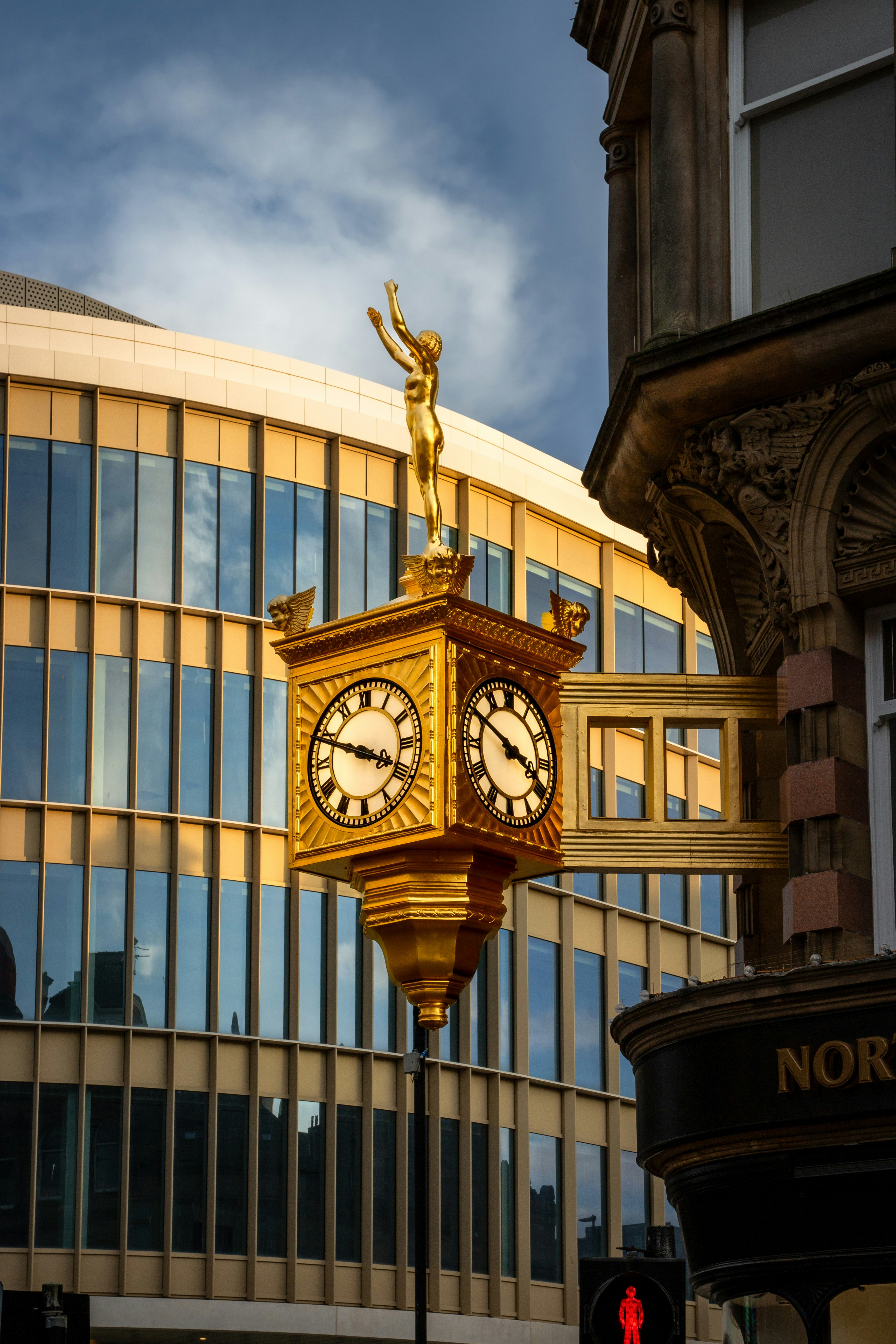 Golden clock tower with statue against modern building photo – Free ...