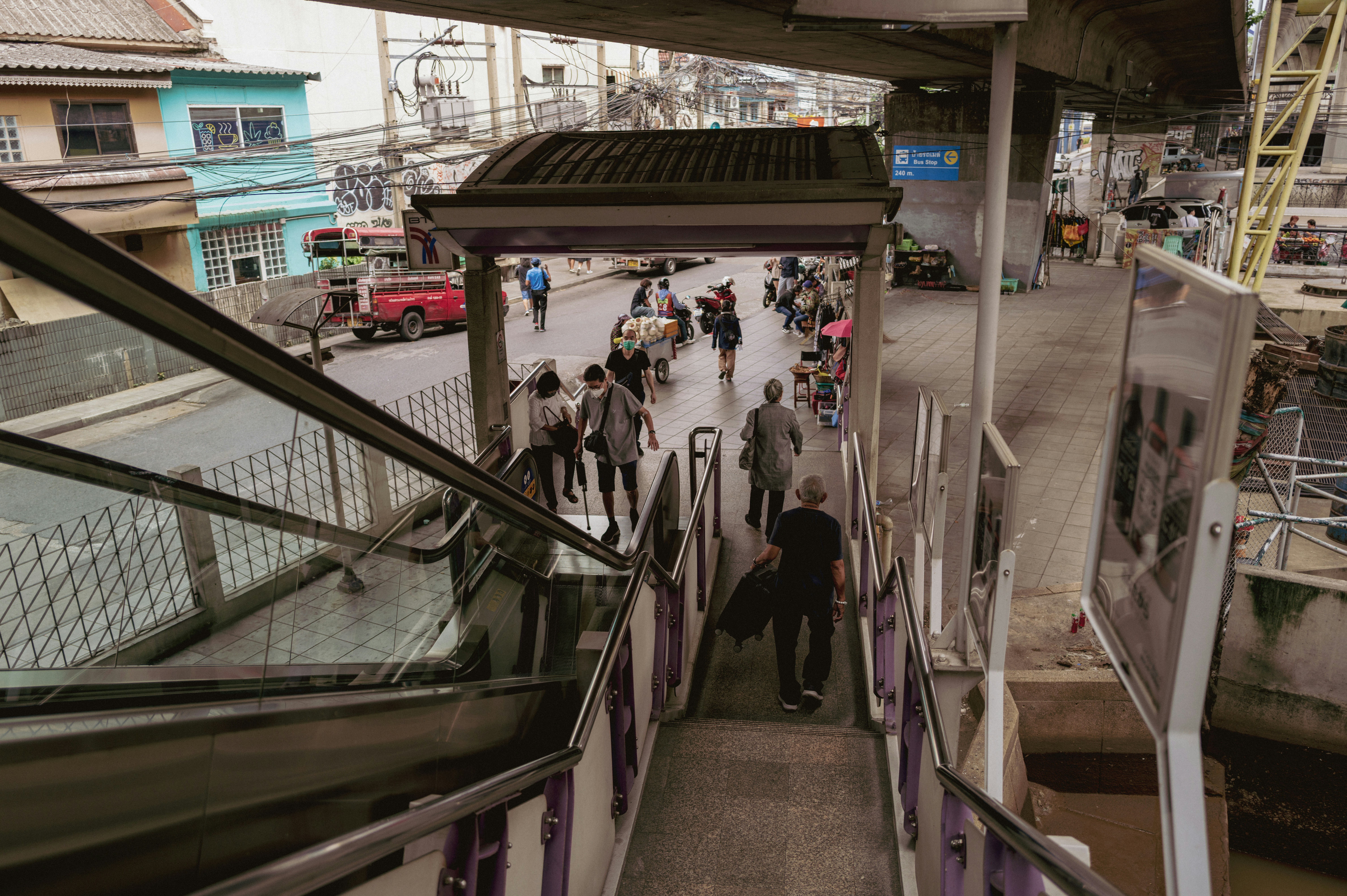 Steps to the Market: A Busy Pedestrian Cascade Beneath the City’s Overpass