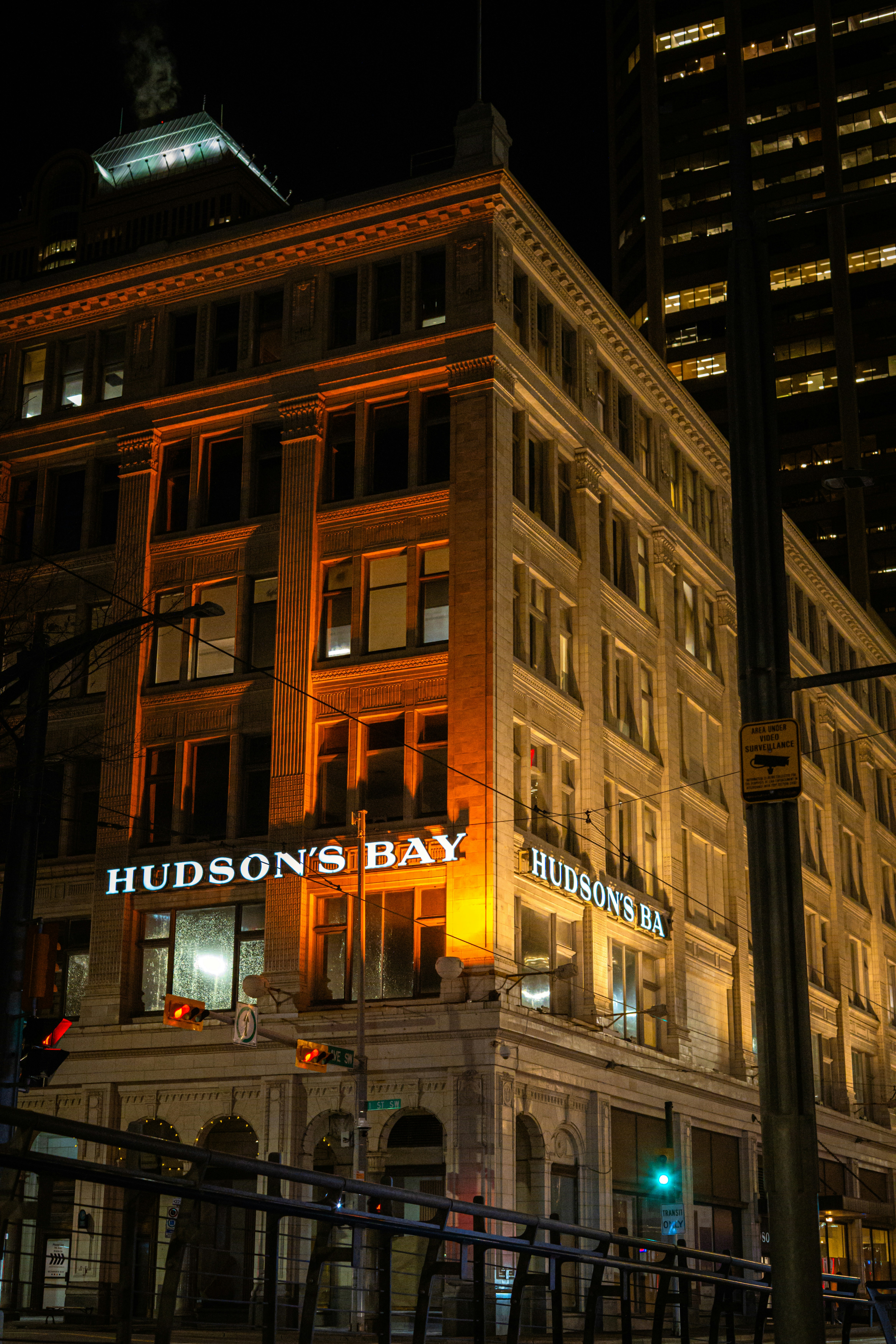 Night Facade of Hudson's Bay: Neon Sign, Brick Cornices, and Neon Glow
