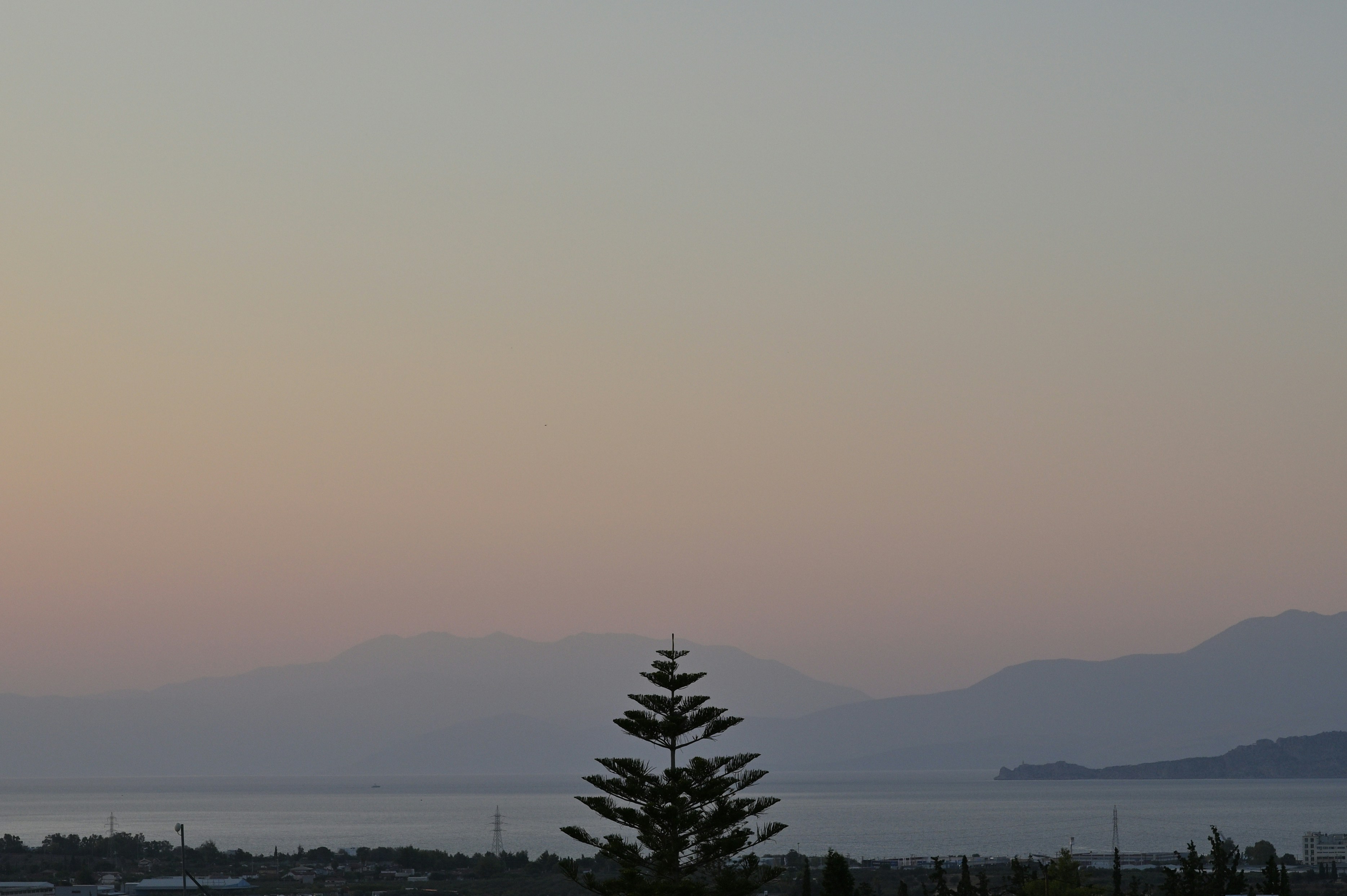 Lone Pine at Dusk: Tranquil Harbor and Veiled Mountains