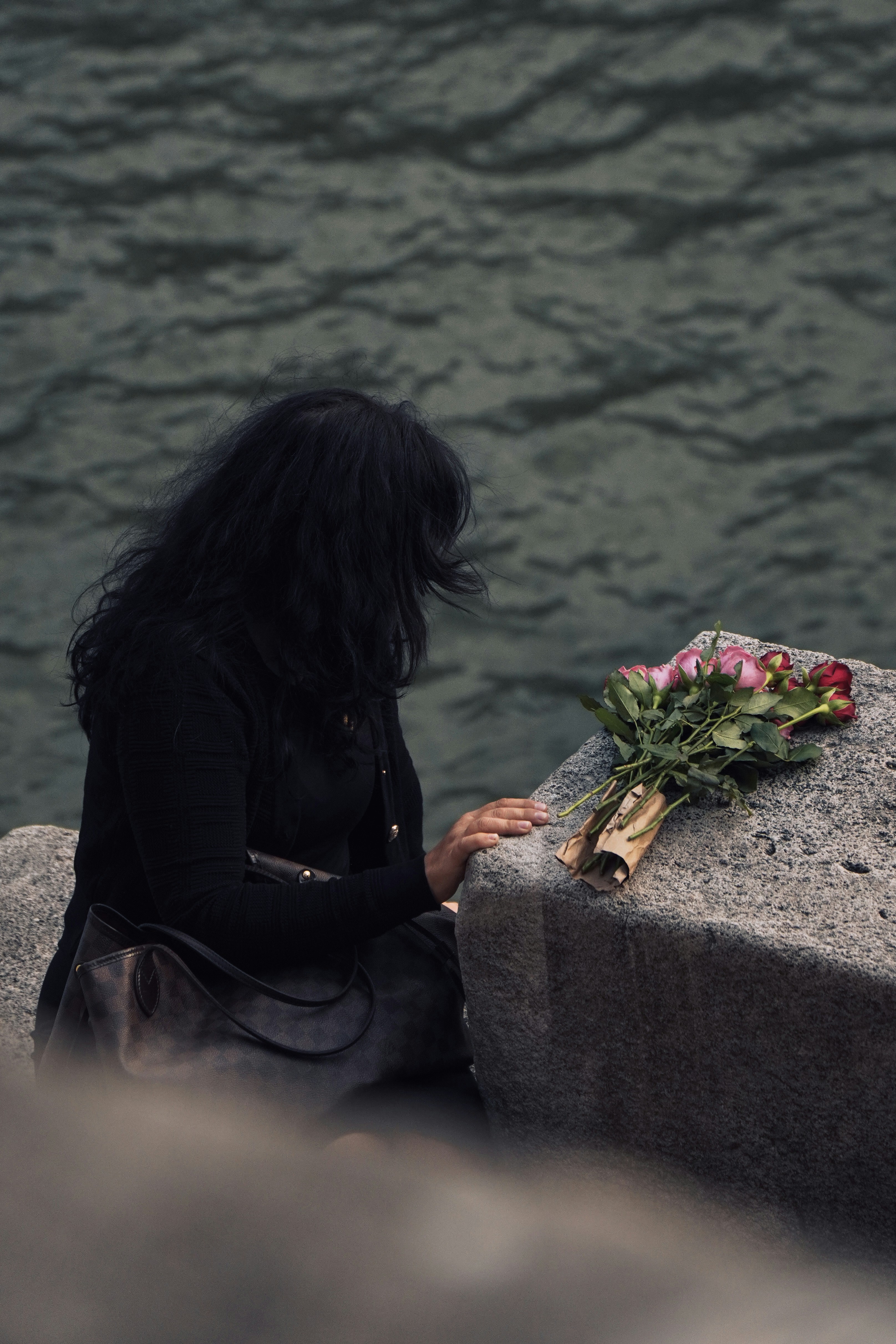 Bouquet by the Granite Edge: Quiet Moment at the Waterfront
