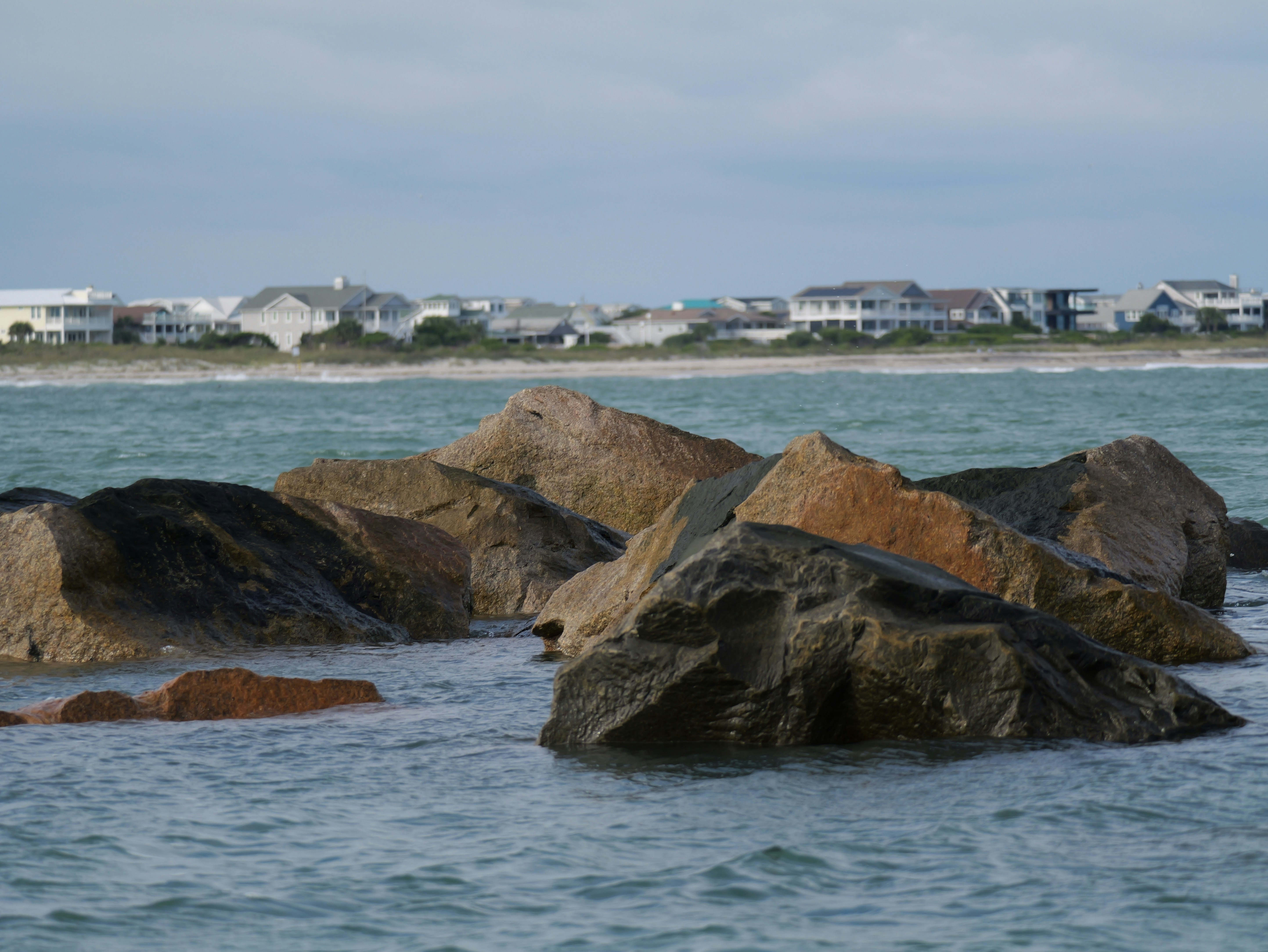 Granite Breakwaters Stand Guard Over a Quiet Seaside Village