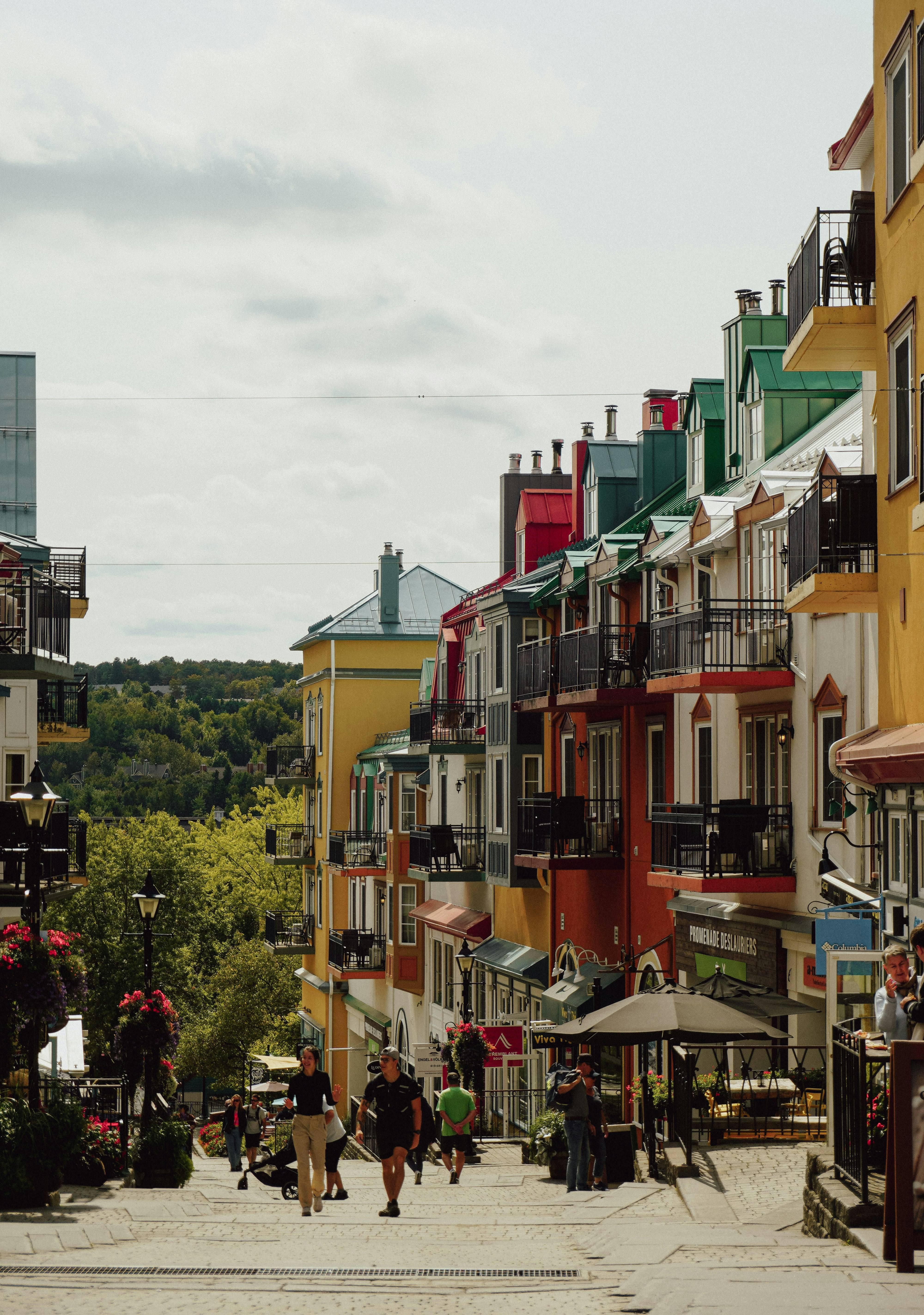 Colorful Row: A sunlit street of stacked facades and café chatter