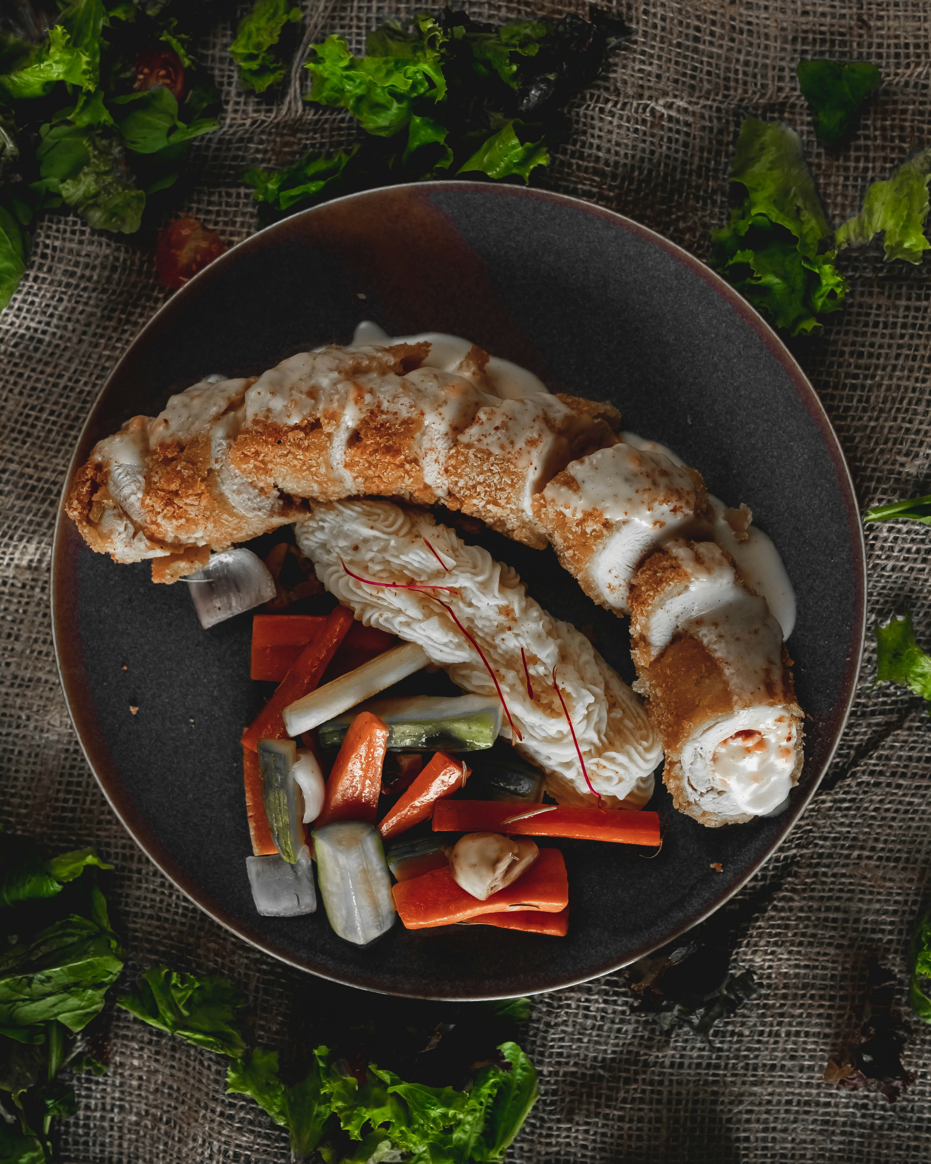 Crisped Crescent Fish with Cream Drizzle and Colorful Vegetable Mosaic