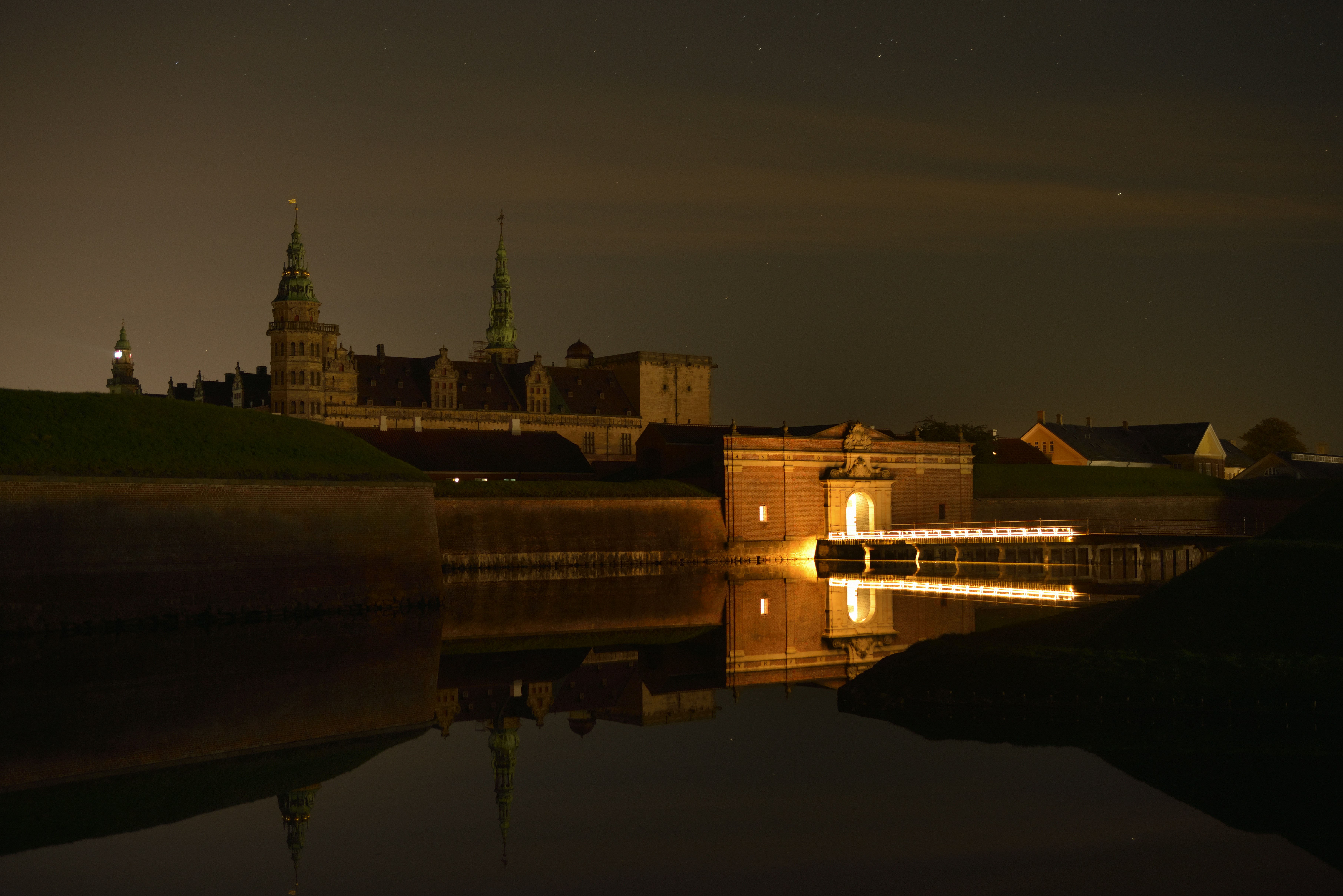 Overlooking Kronborg Castle on a Saturday night in October in Elsinore, Denmark. Kronborg Castle dates back to 1420 when Eric of Pomerania built Krogen, a fortress that was to control the entrance to Oresund and collect the lucrative Sound Dues from the passing ships.
