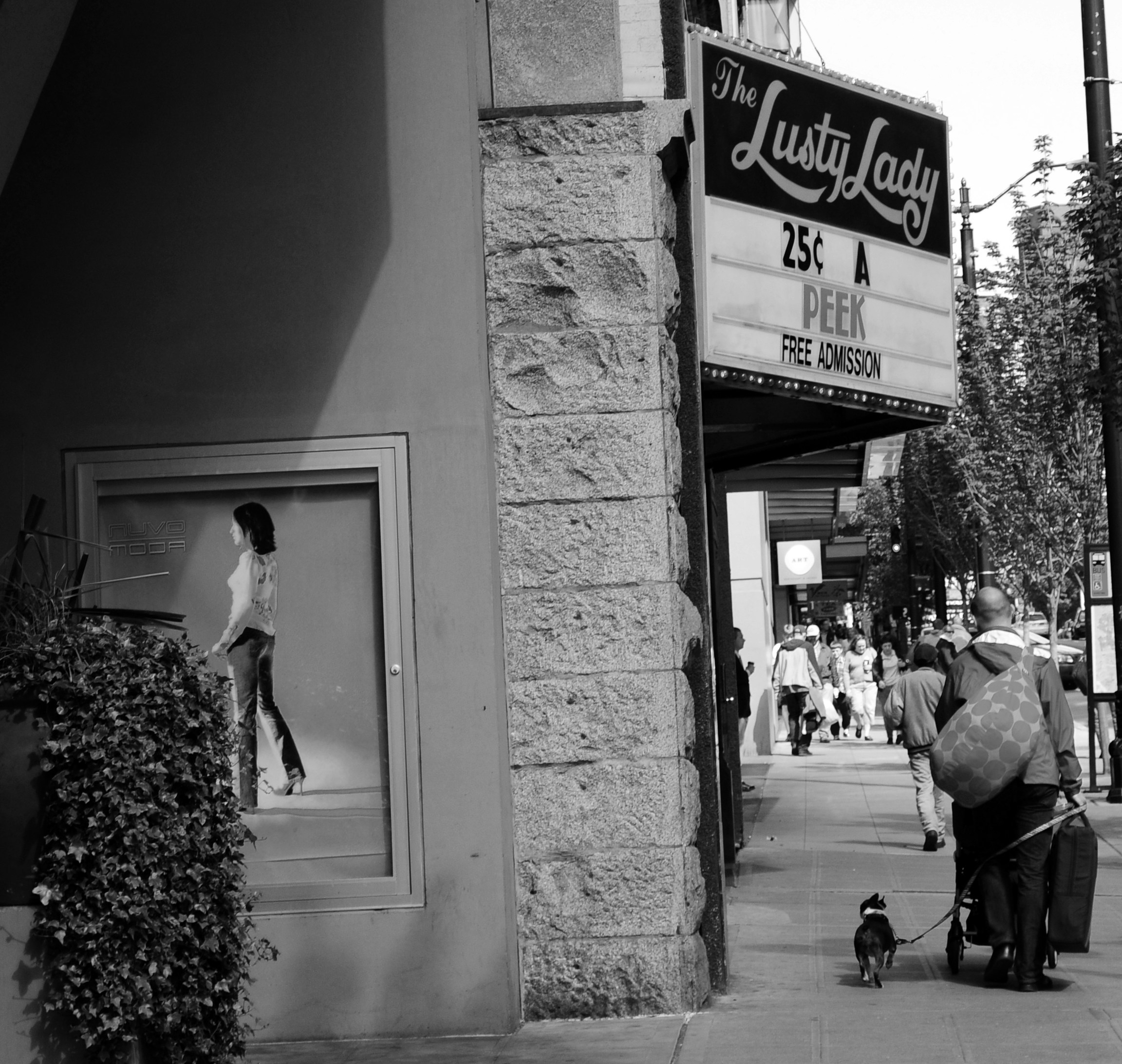 Woman walks by "the lusty lady" peep show. photo – Free Travel Image on ...