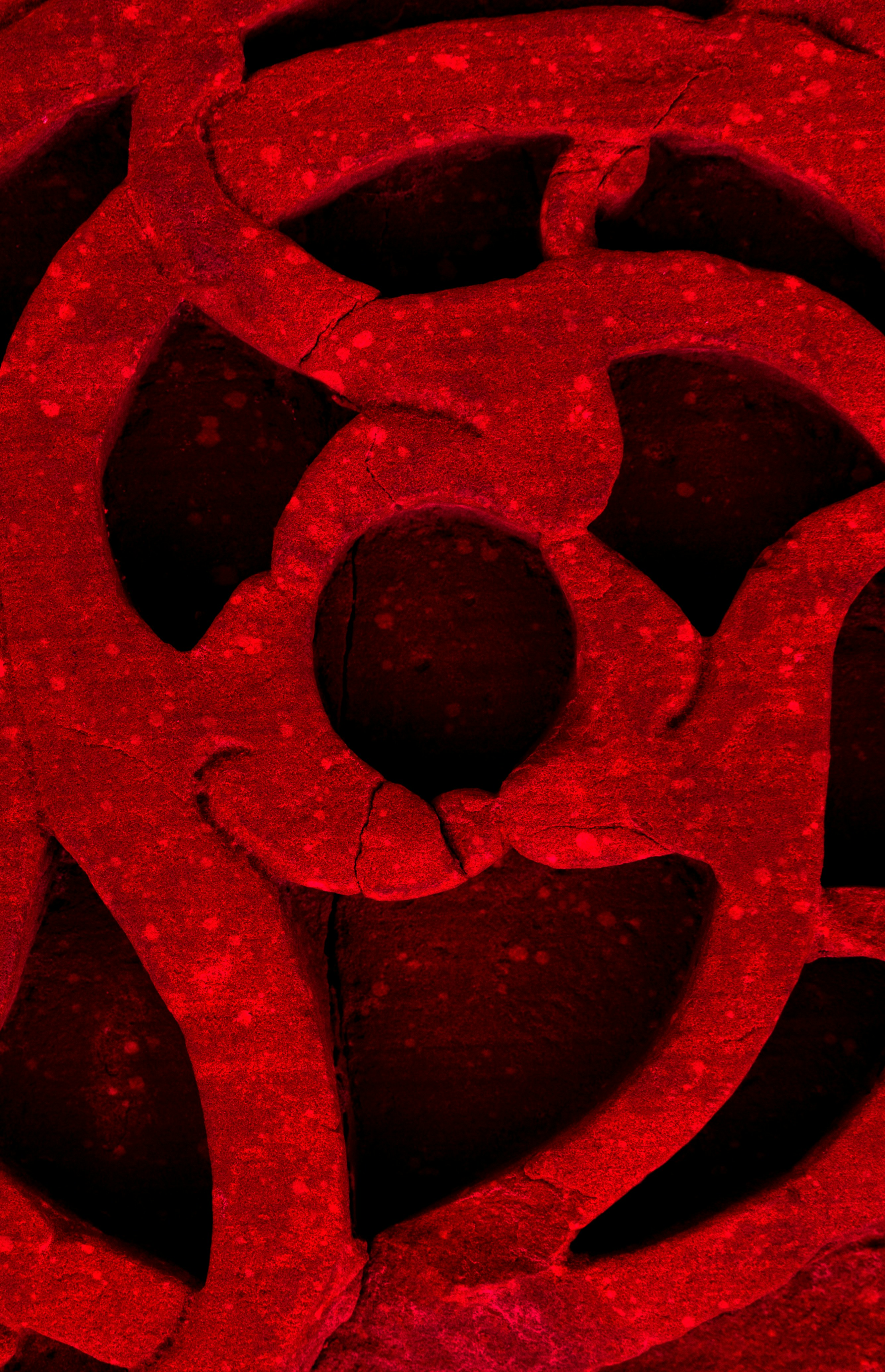 An experimental photo an intricate stone lattice with geometric cutouts at Qutb Minar. The carved pattern and fine surface texture make it perfect for use in design projects, architectural renderings, cultural visuals, or abstract art backgrounds that highlight craftsmanship and detail.