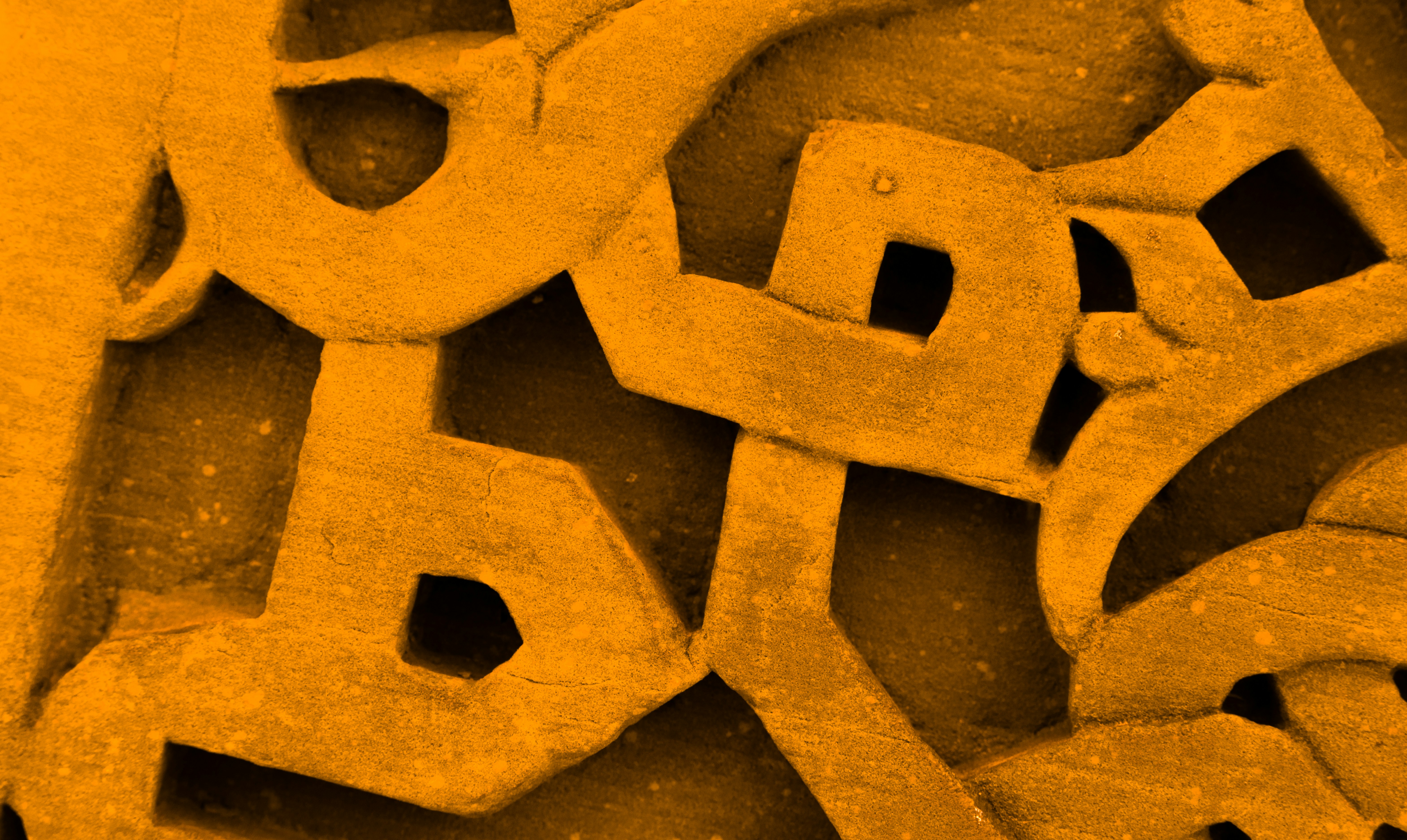 Amber Mesh: Close-Up of Interlocking Orange Fragments
