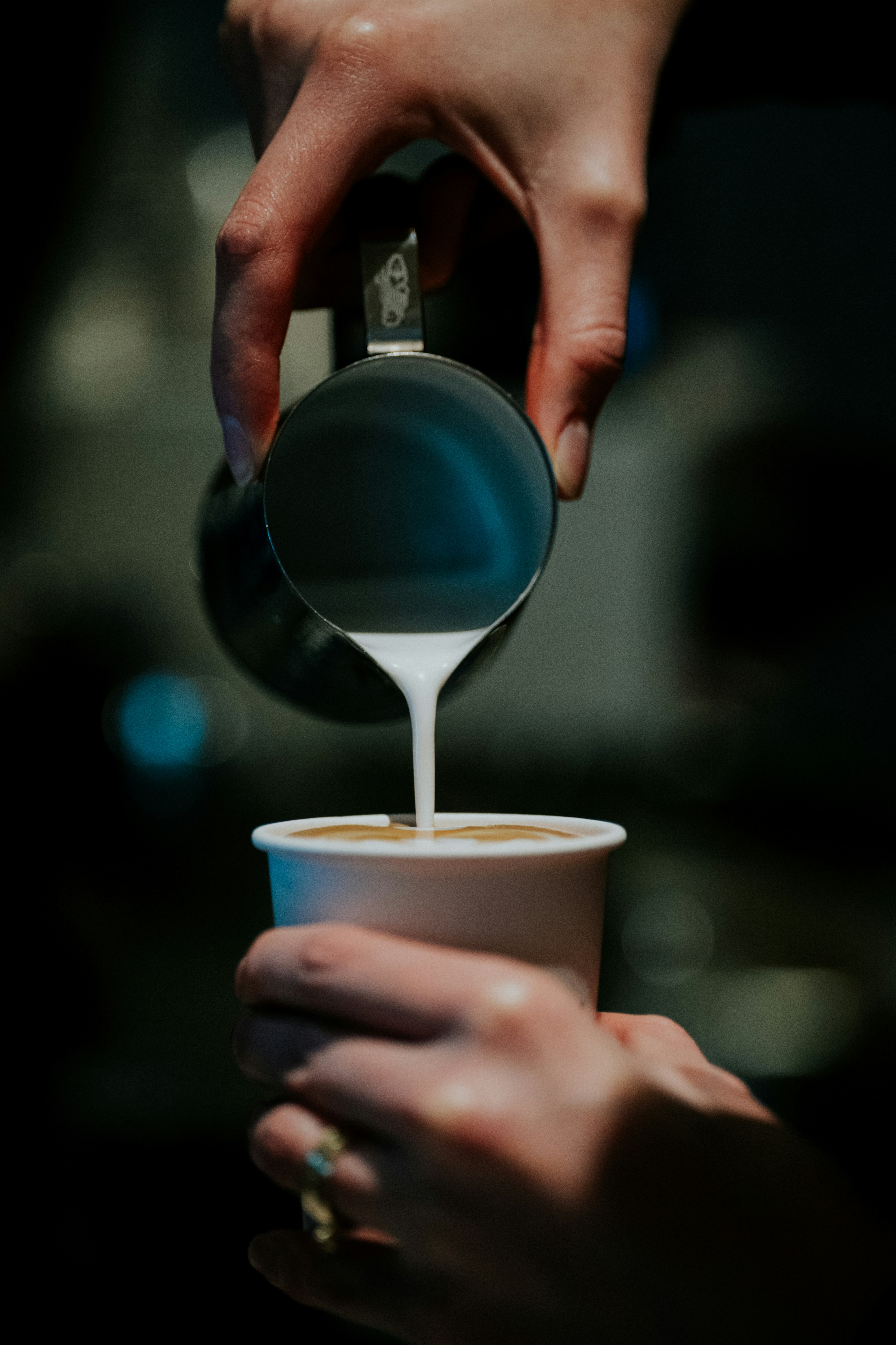 Milky Thread in a Dim Café: A Quiet Pour