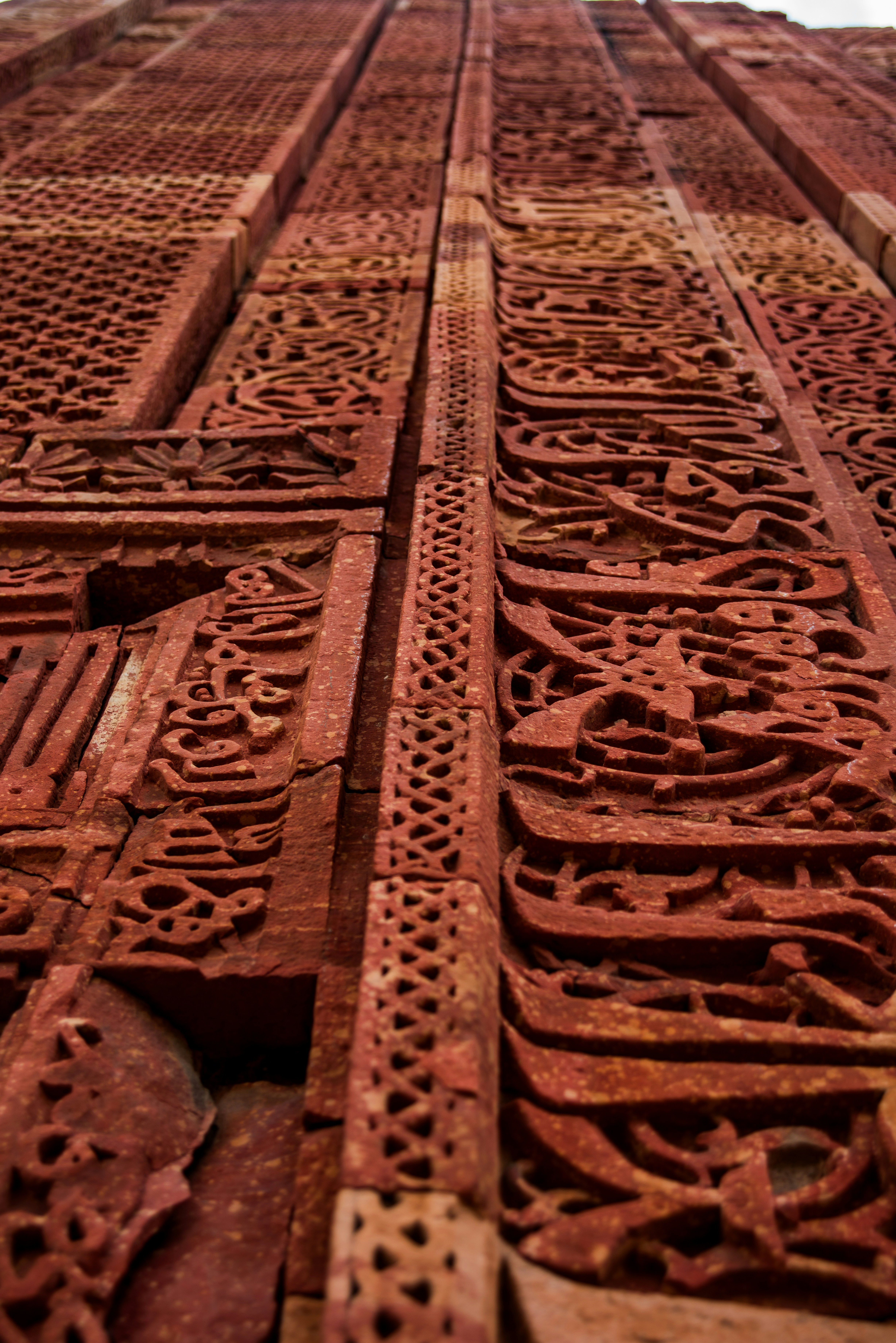 Rust-Red Filigree: Carved Brickwork Reigns the Frame