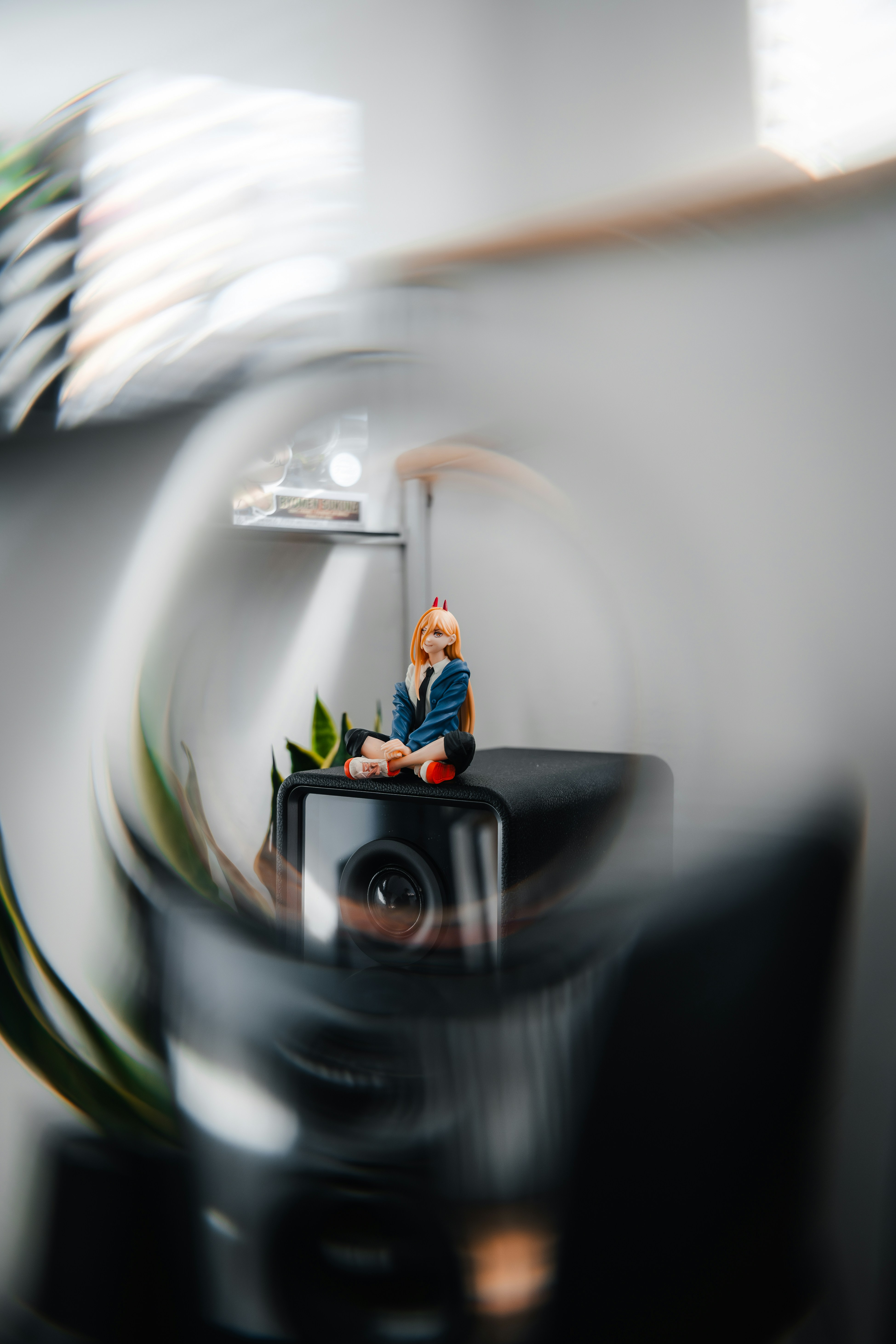 Circle of Focus: Tiny Orange-Haired Figure Framed by a Lens Ring