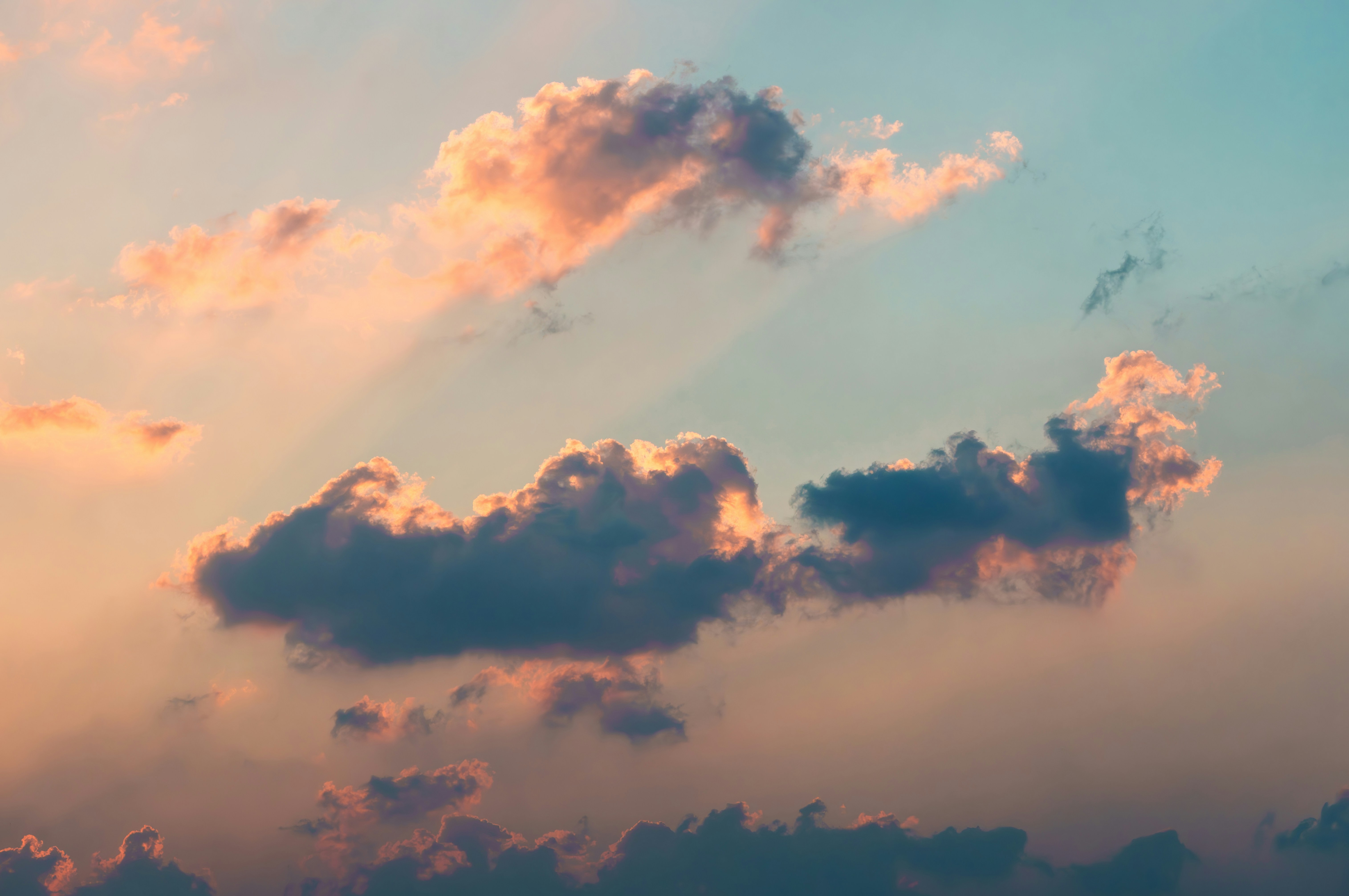 Evening Sky Mosaic: Peach Clouds and Indigo Horizon