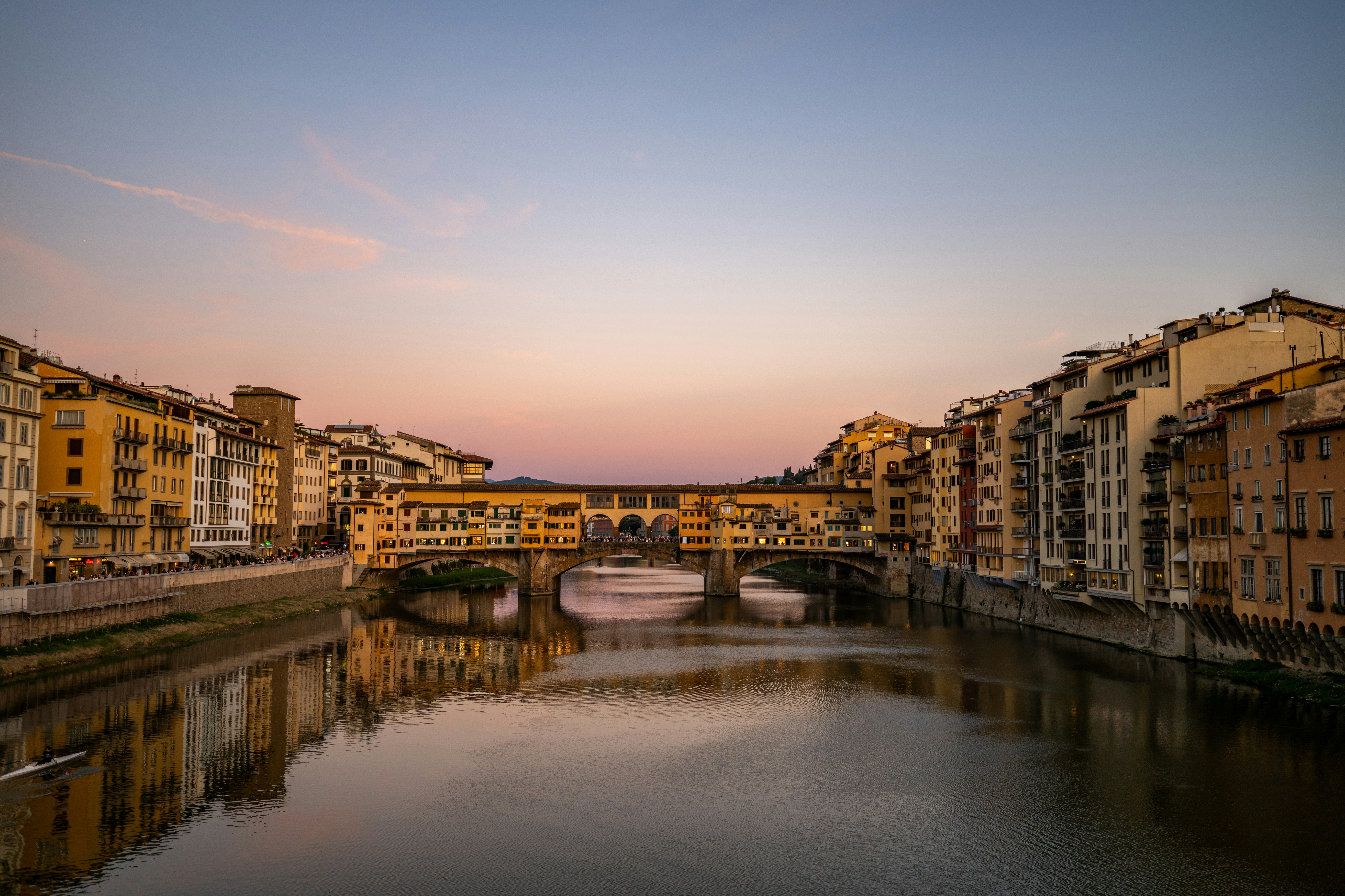 Golden Hour Over the Arno: Ponte Vecchio and Reflections Framing Florence's Sunset