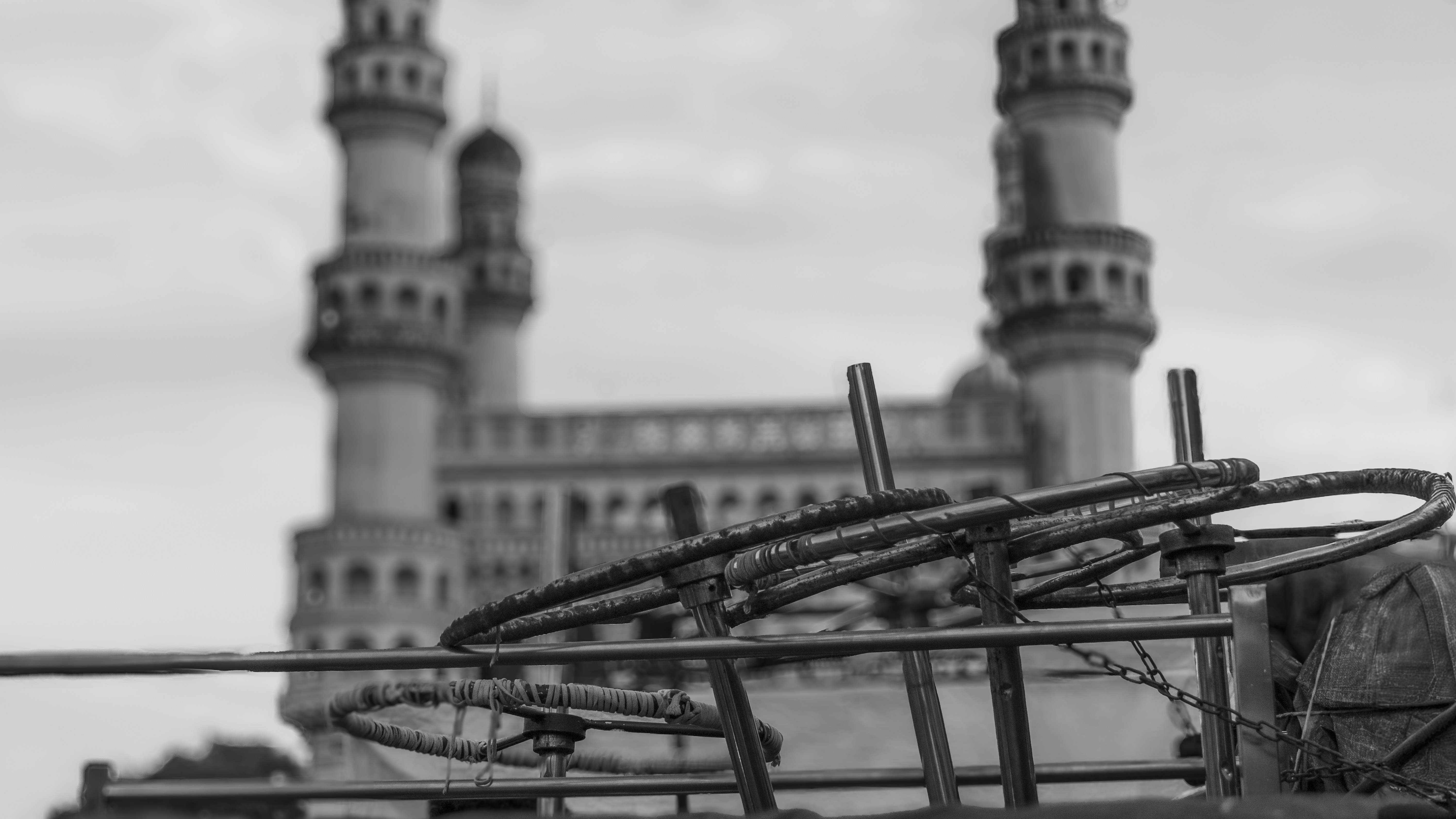 Rusted Hoop Framing a Distant Fortress Skyline