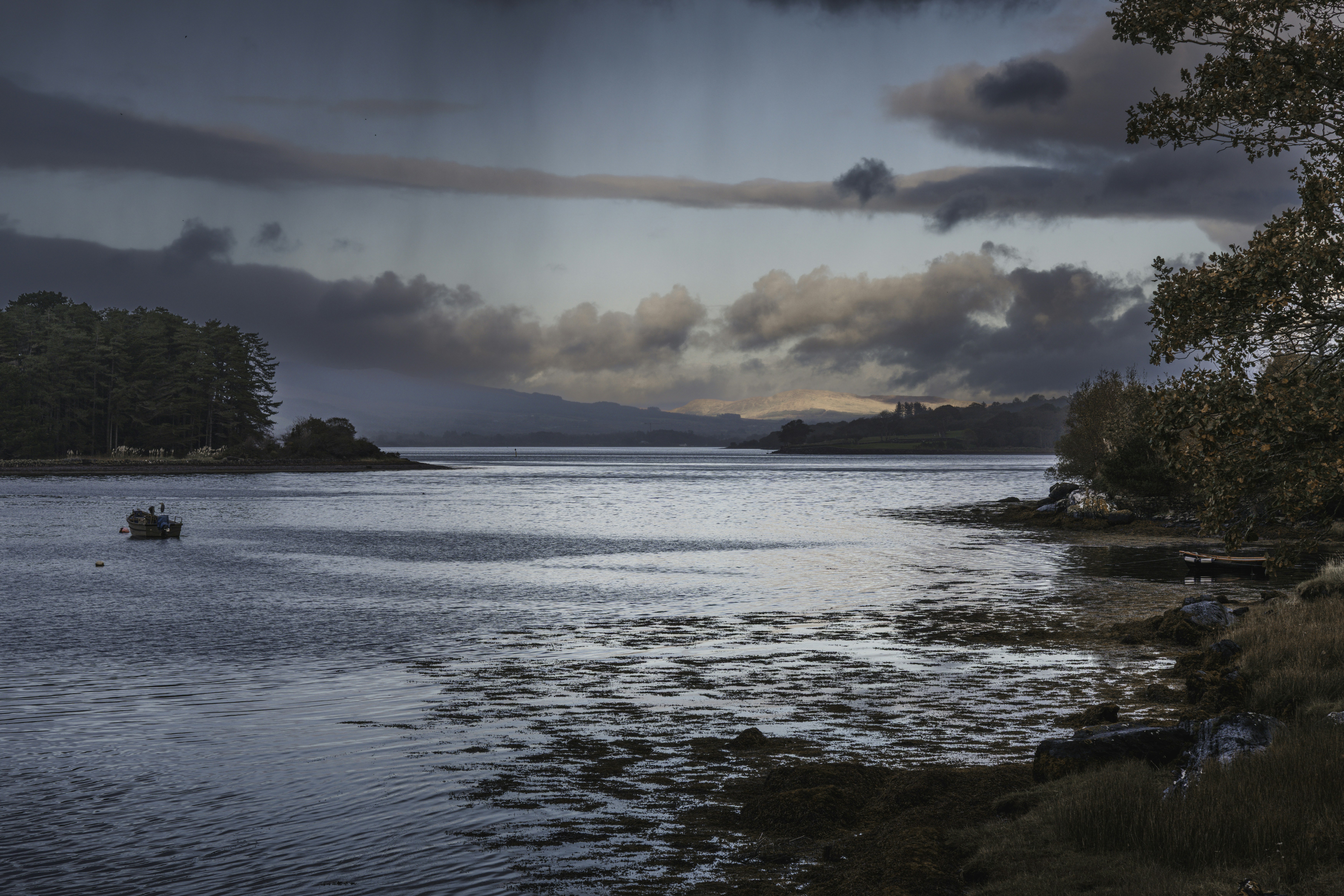 Whispered Dusk Over an Inlet: A Lone Boat at the Edge of Quiet