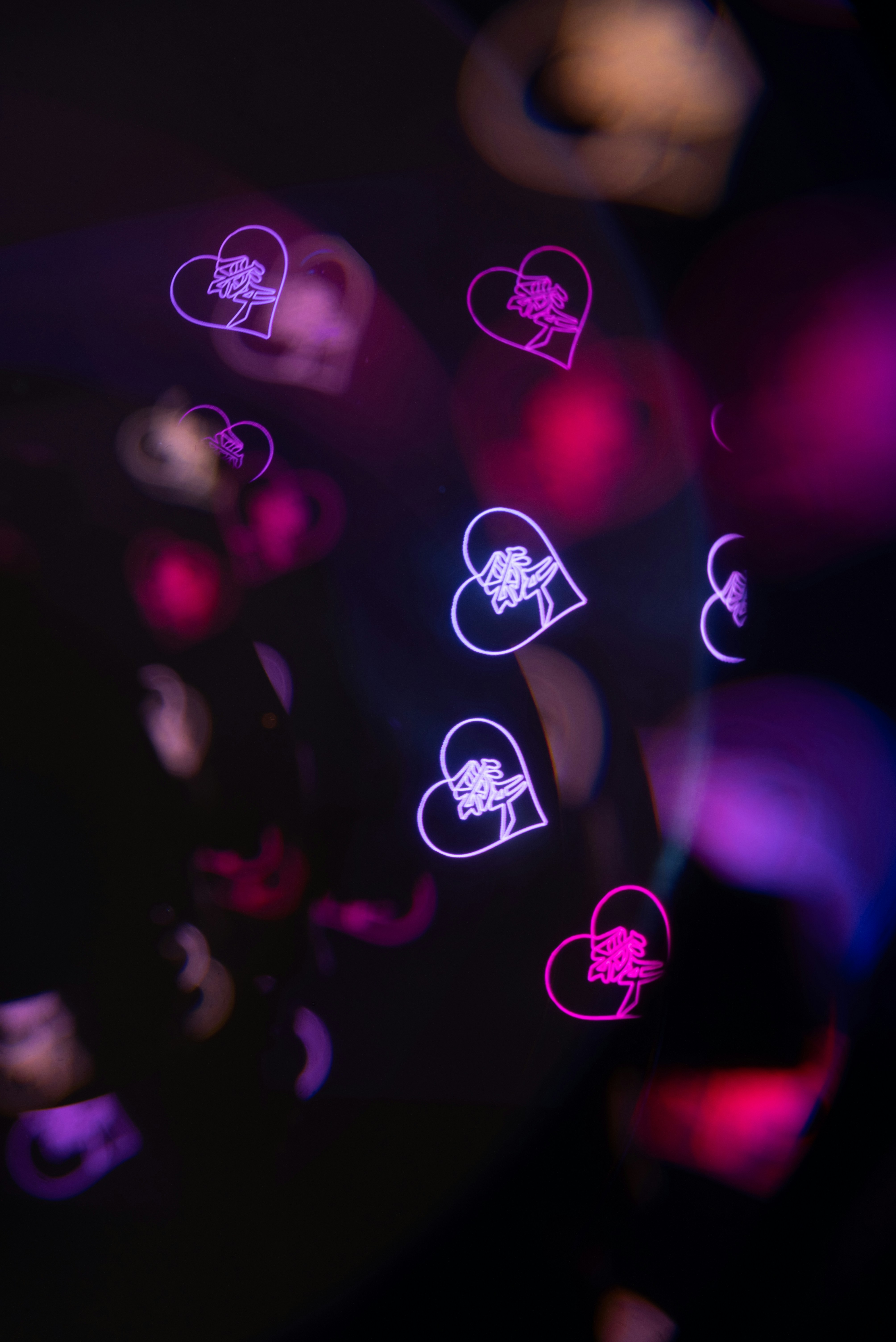 Neon Hearts in Focus: Bokeh Echoes of Shine