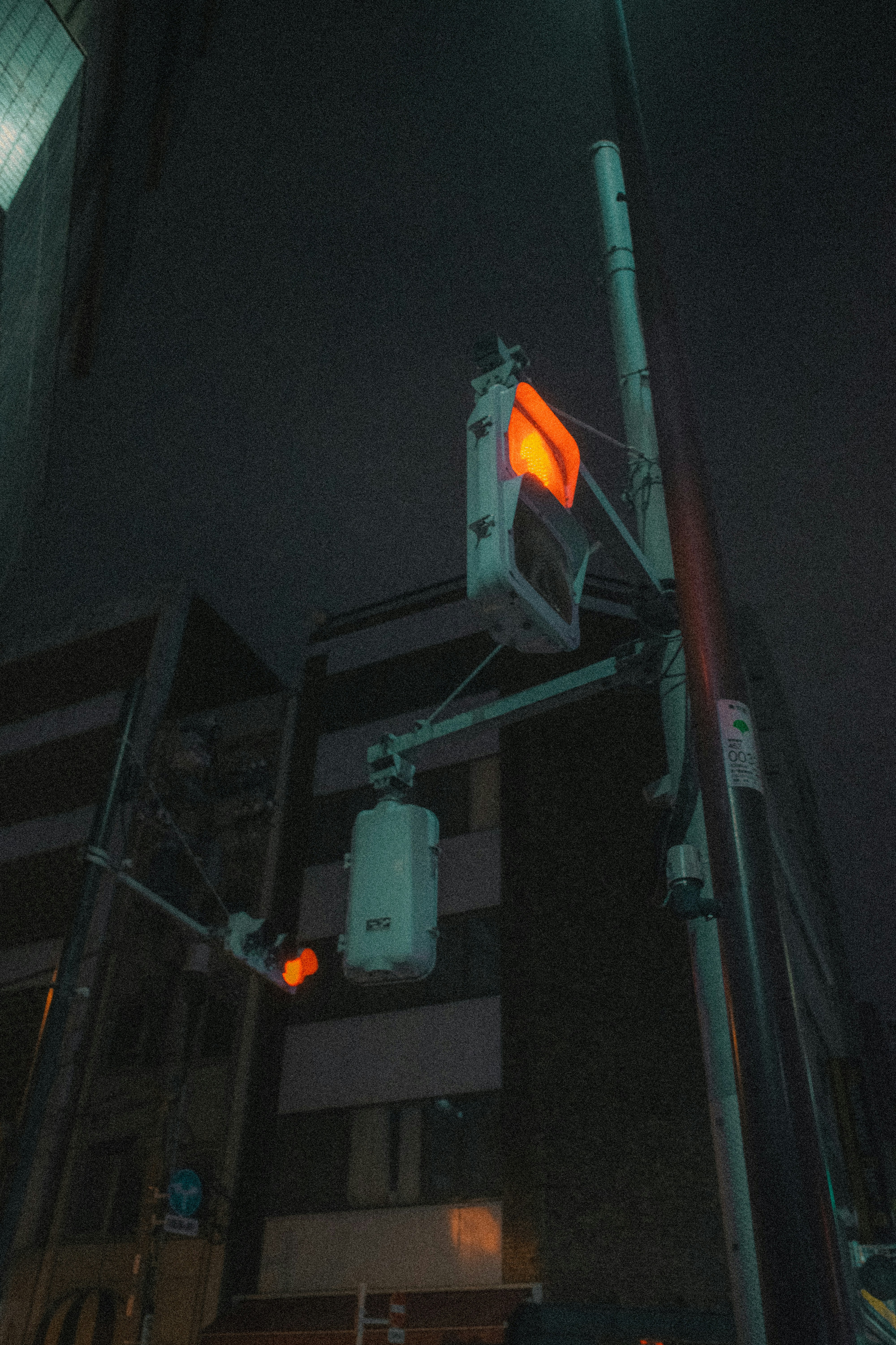 Ember at the Crosswalk: Night Street Signal in a Quiet City Block
