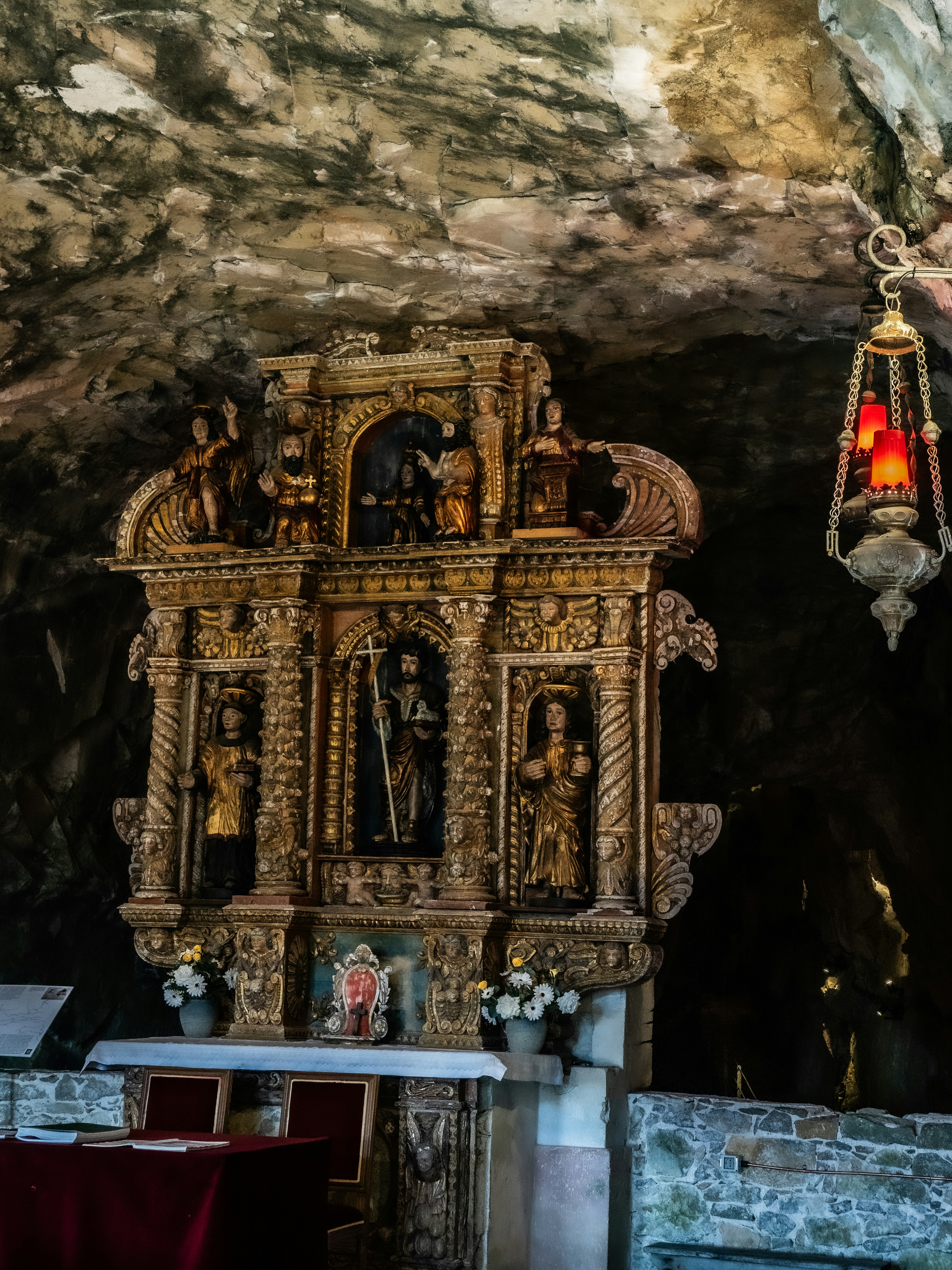 Cavern Shrine: The Gilded Altar Beneath a Red Lantern