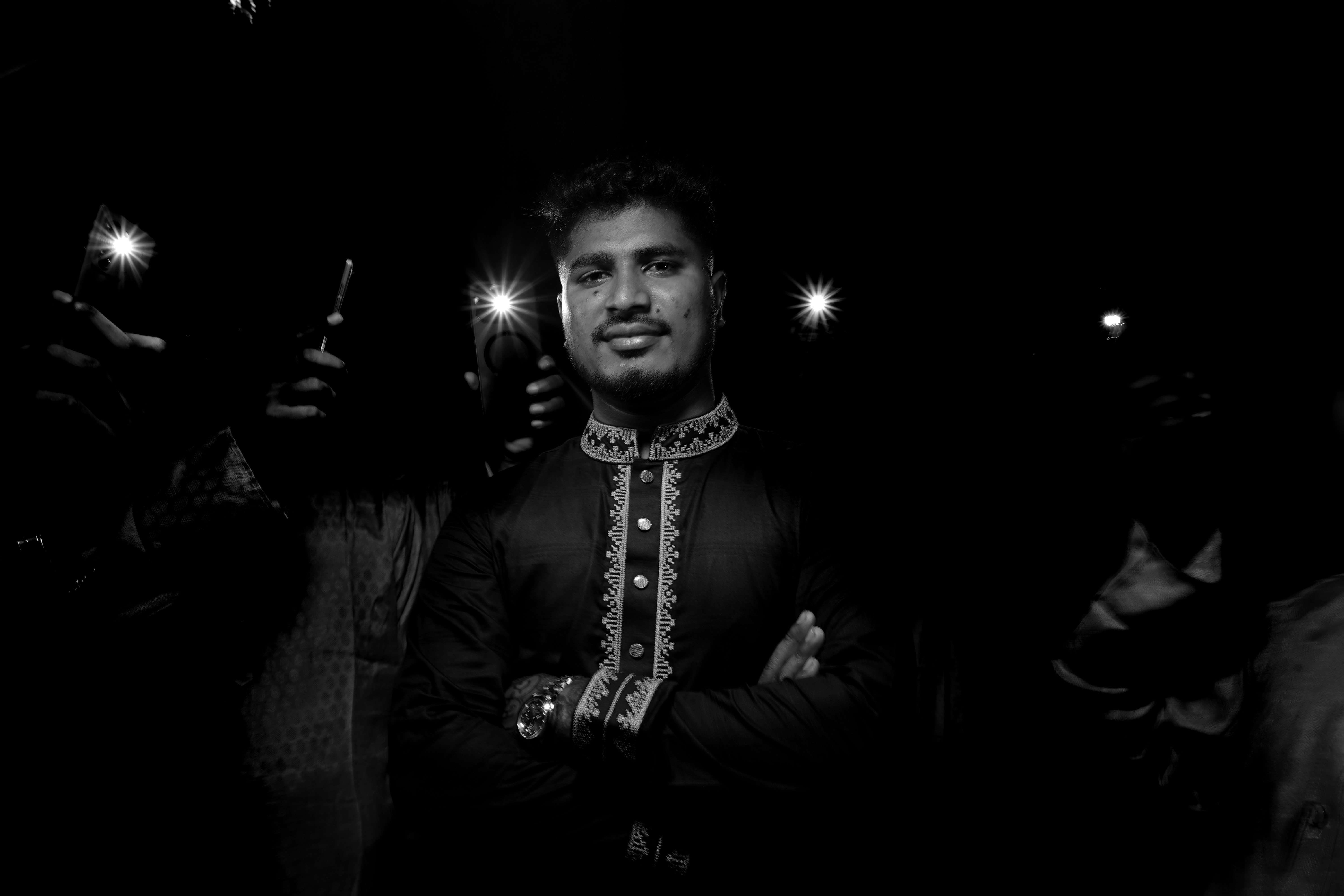 Ornate Garb in the Dark: A Center-Stage Portrait Amidst Sparks